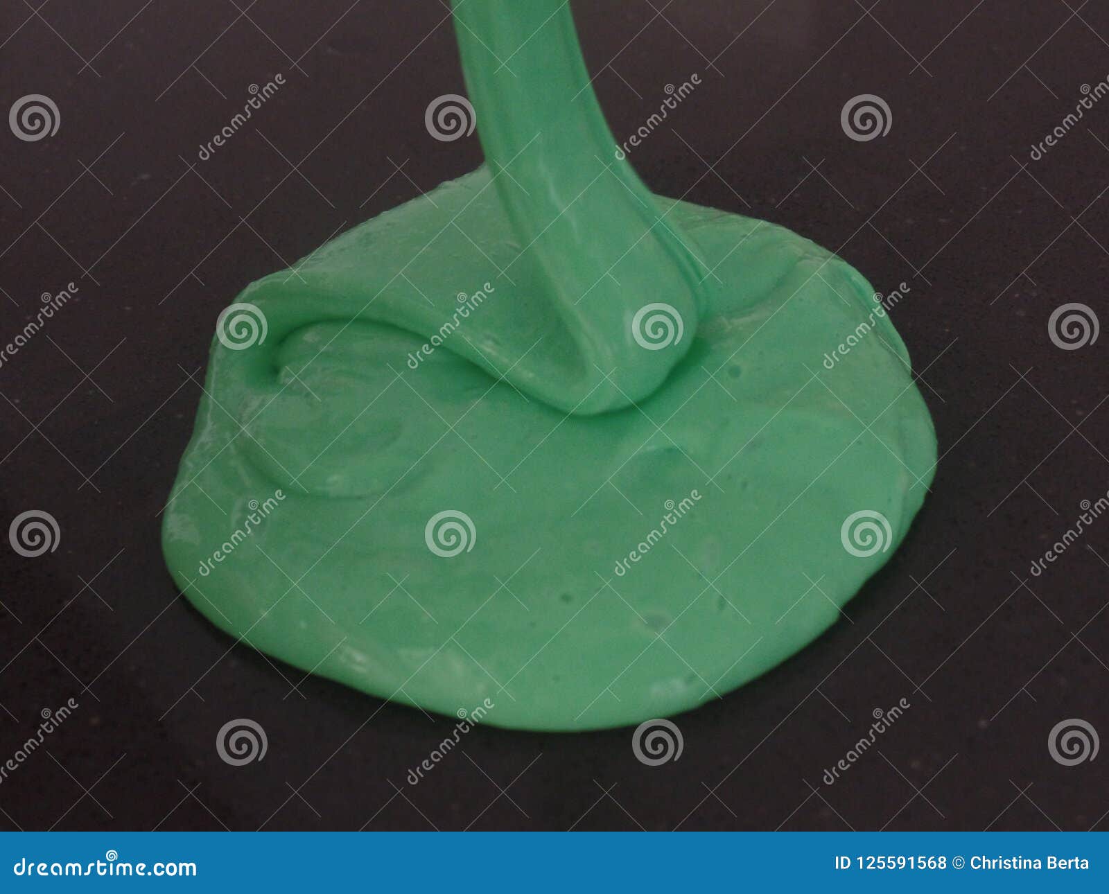 Creating Patterns Out of Bright Green Slime Stock Photo - Image of ...