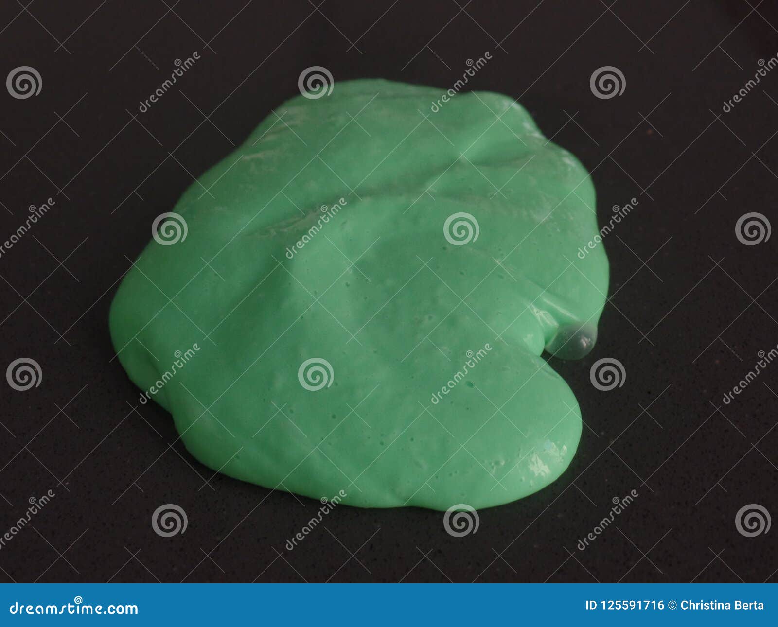 Creating Patterns Out of Bright Green Slime Stock Photo - Image of ...