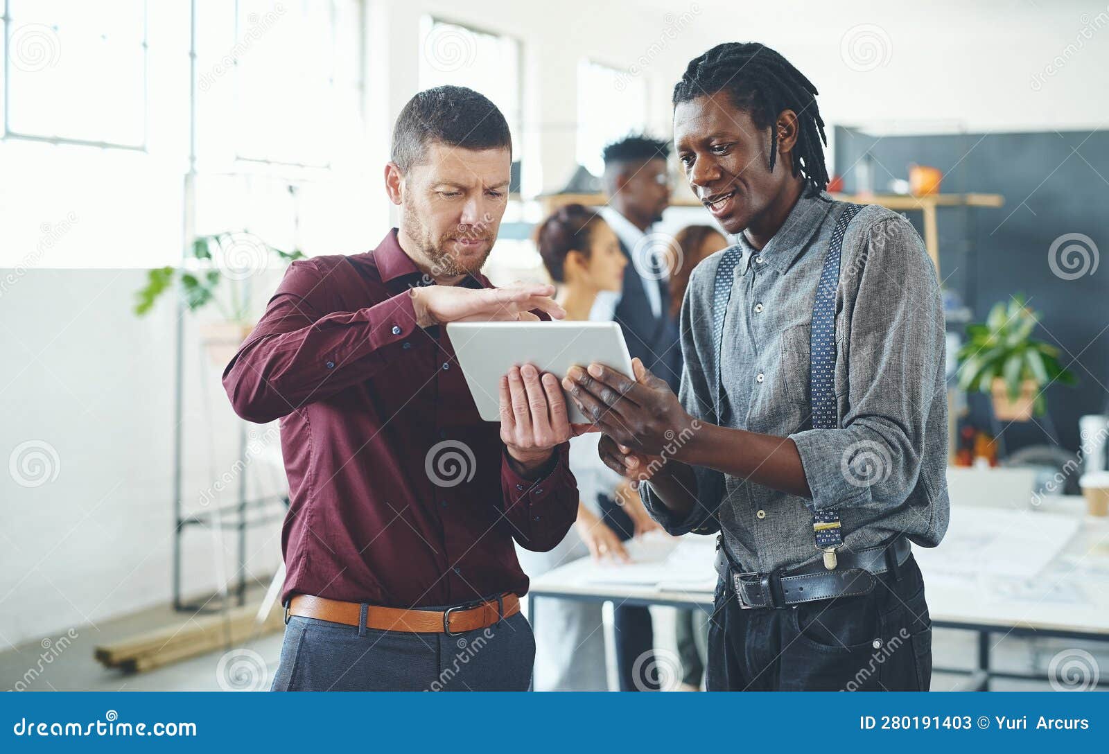Creating Quality Designs. Two Businesspeople Working Together on a ...