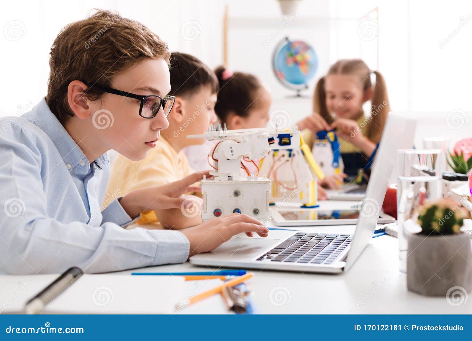 Creating Robots. Concentrated Boy Typing on Laptop Stock Image - Image ...