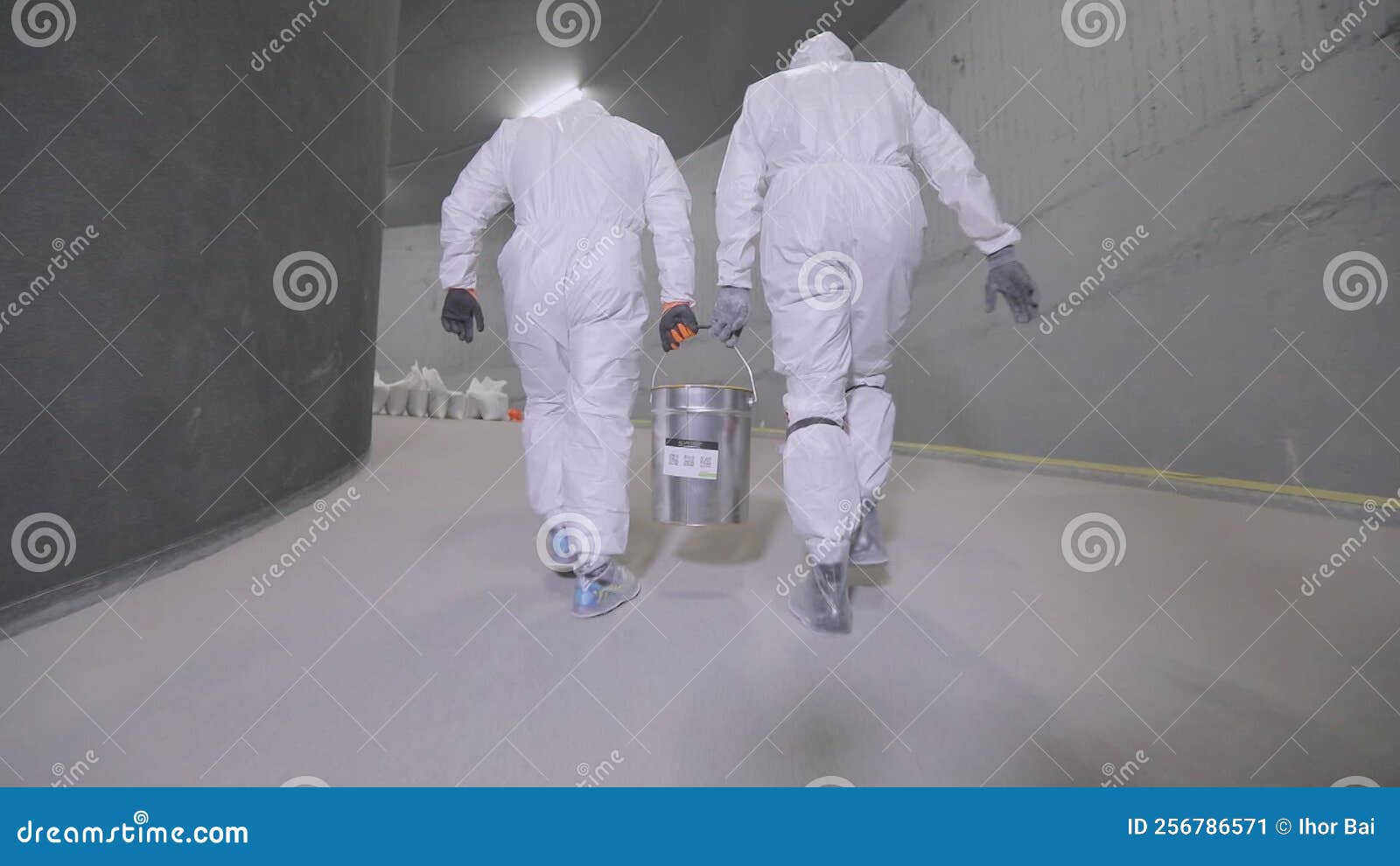 Creating a Self-leveling Floor in the Parking Lot. Builders Carry a ...