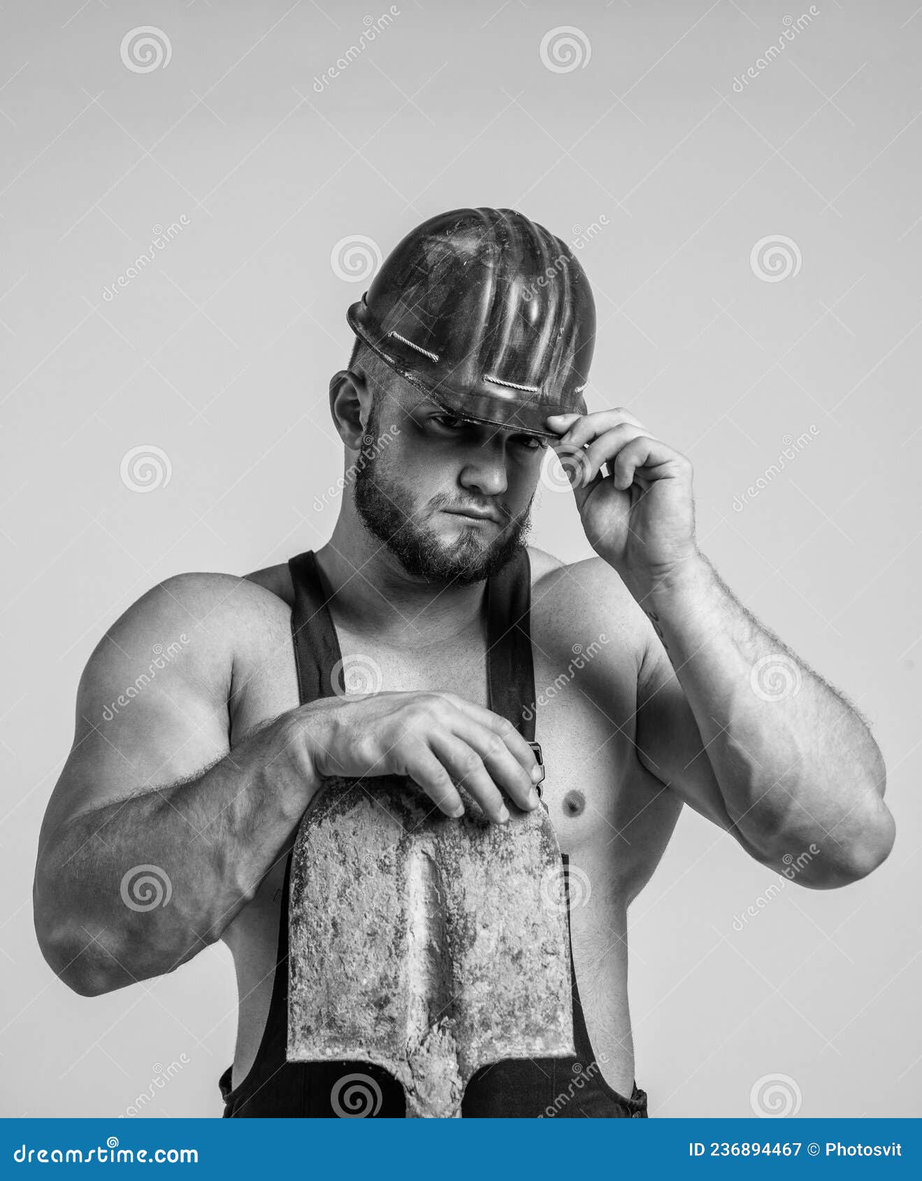 Creating Solid Foundation. Athletic Builder in Helmet. Man with Shovel ...