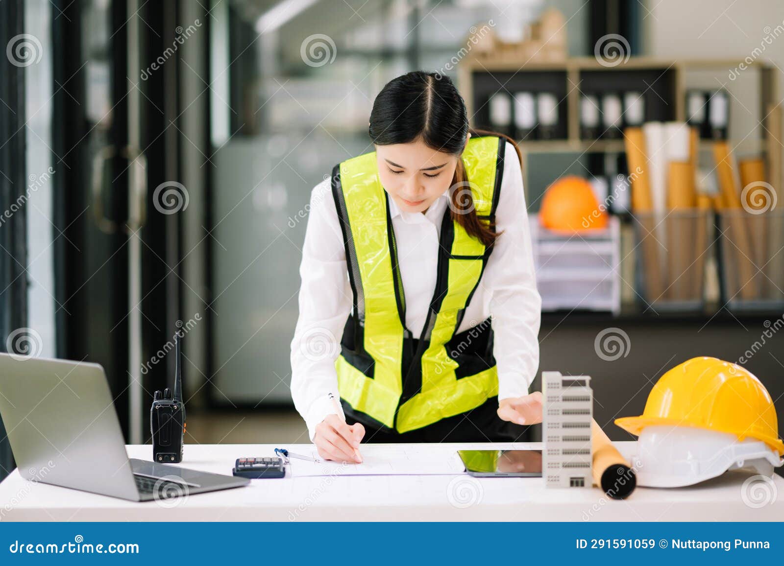 Creative Architect Projecting on the Big Drawings Working and Laptop ...