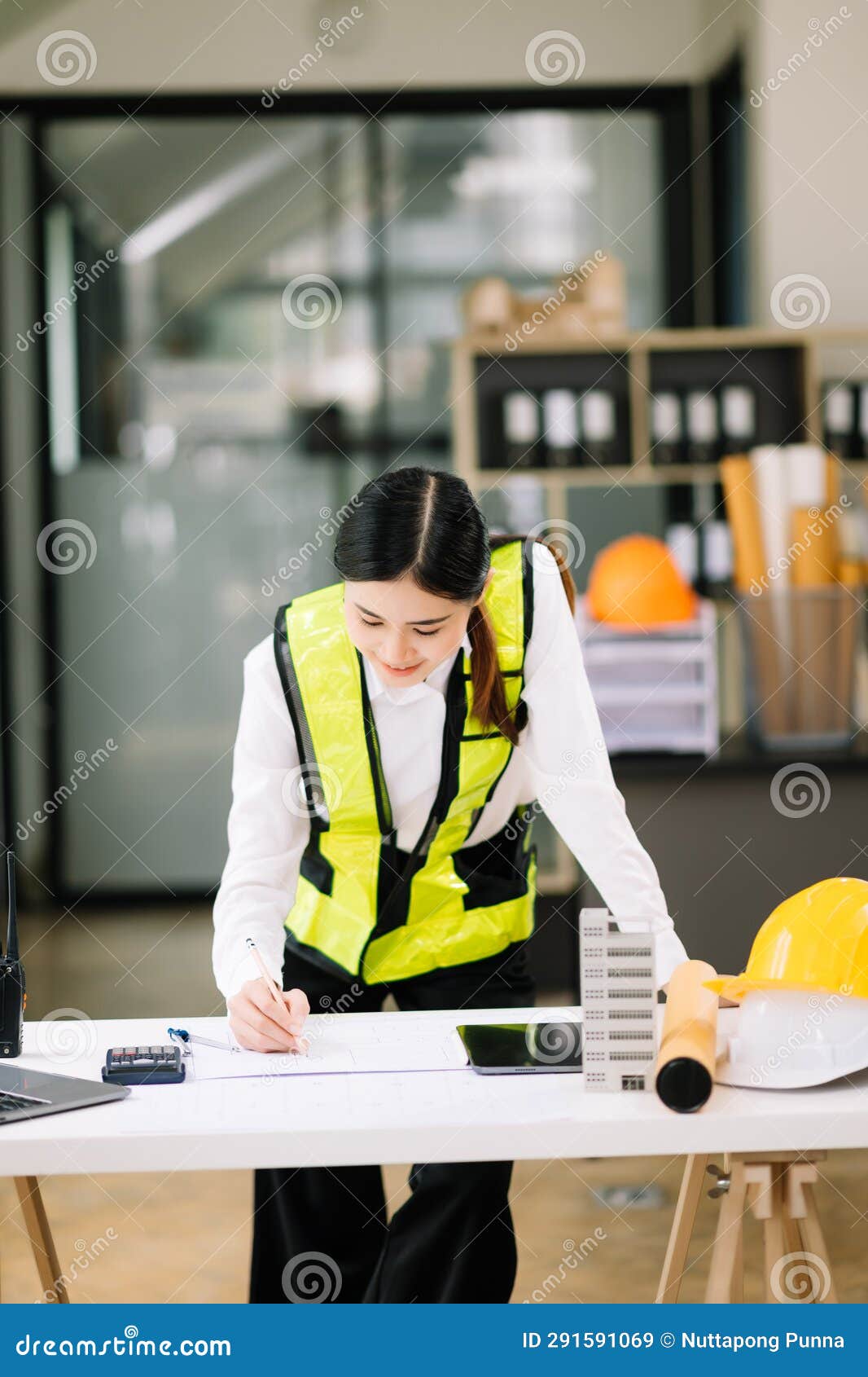 Creative Architect Projecting on the Big Drawings Working and Laptop ...