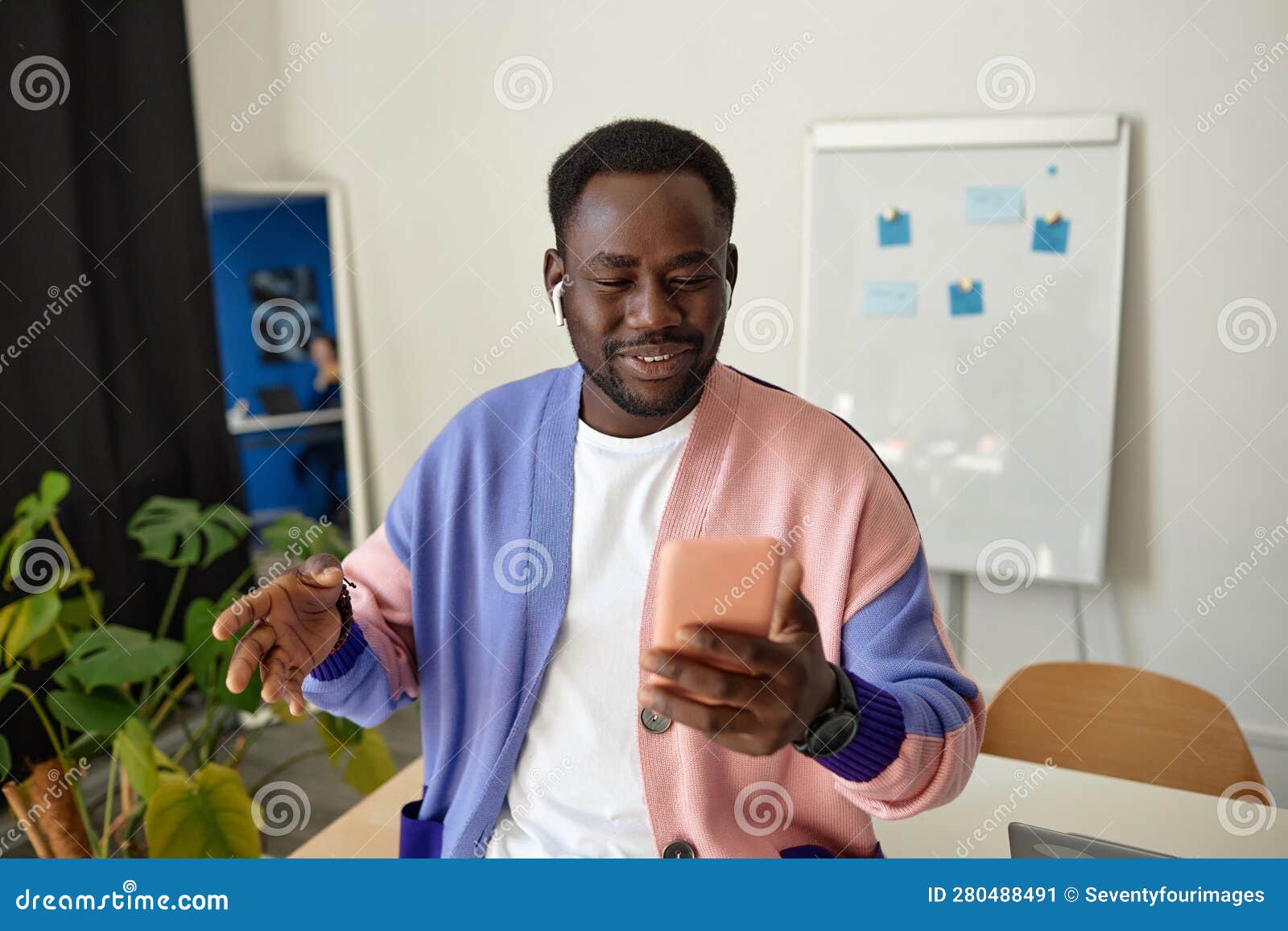 Creative Black Man Using Smartphone with Videochat in Office Stock ...