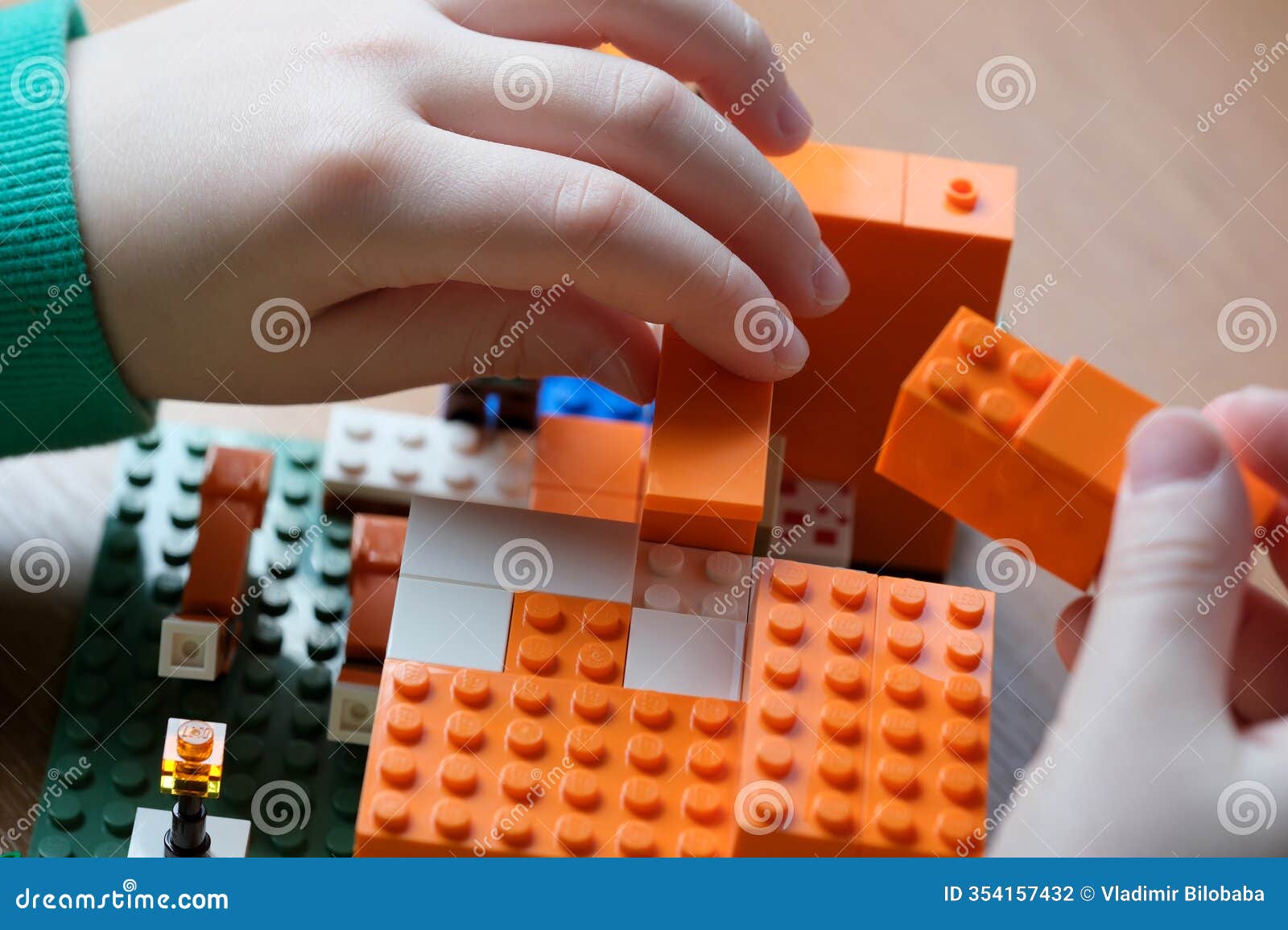 Creative Building with Bright Orange Blocks at a Cozy Workspace ...