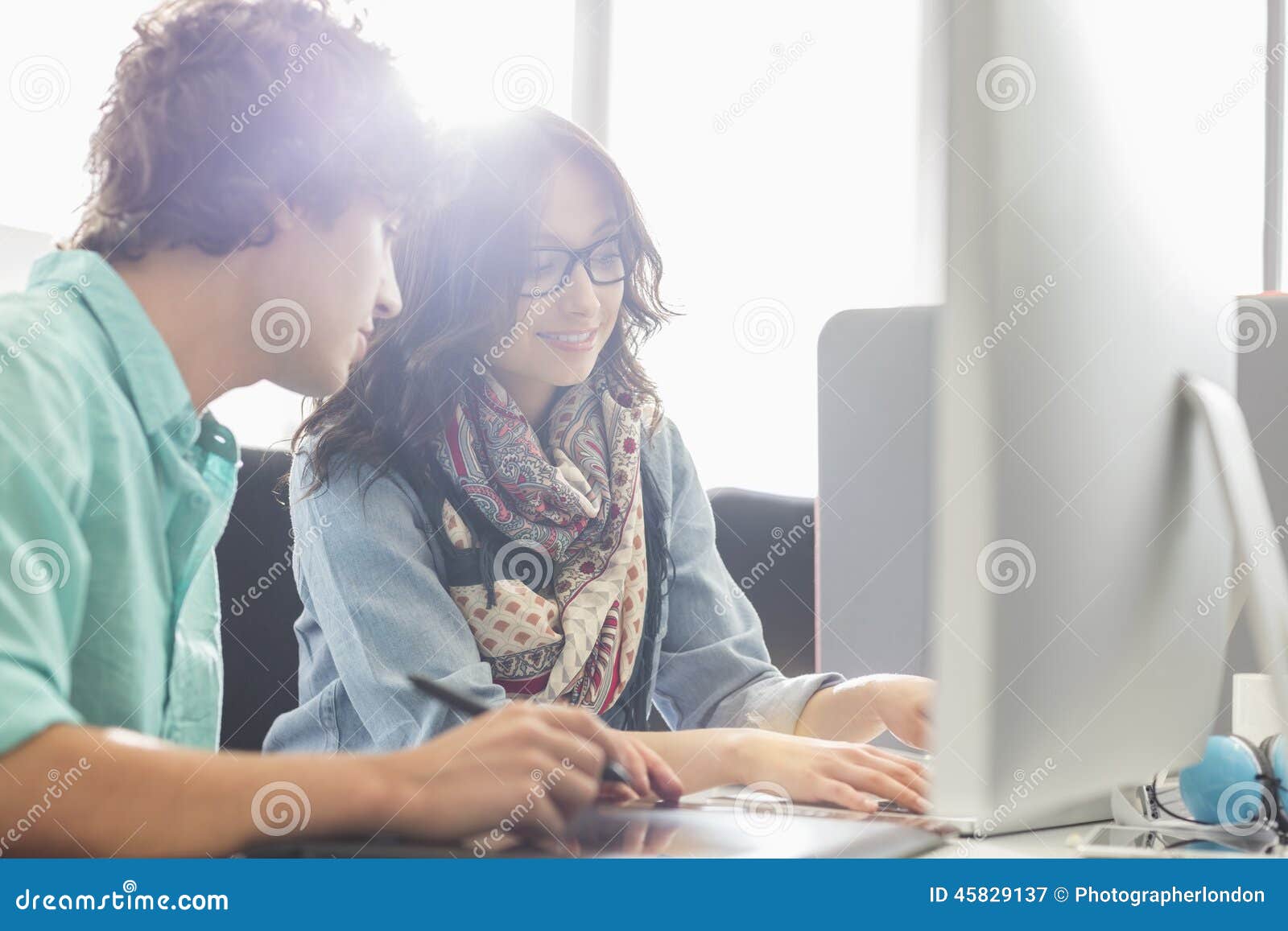 Creative Business Colleagues Using Desktop Computer in Office Stock ...