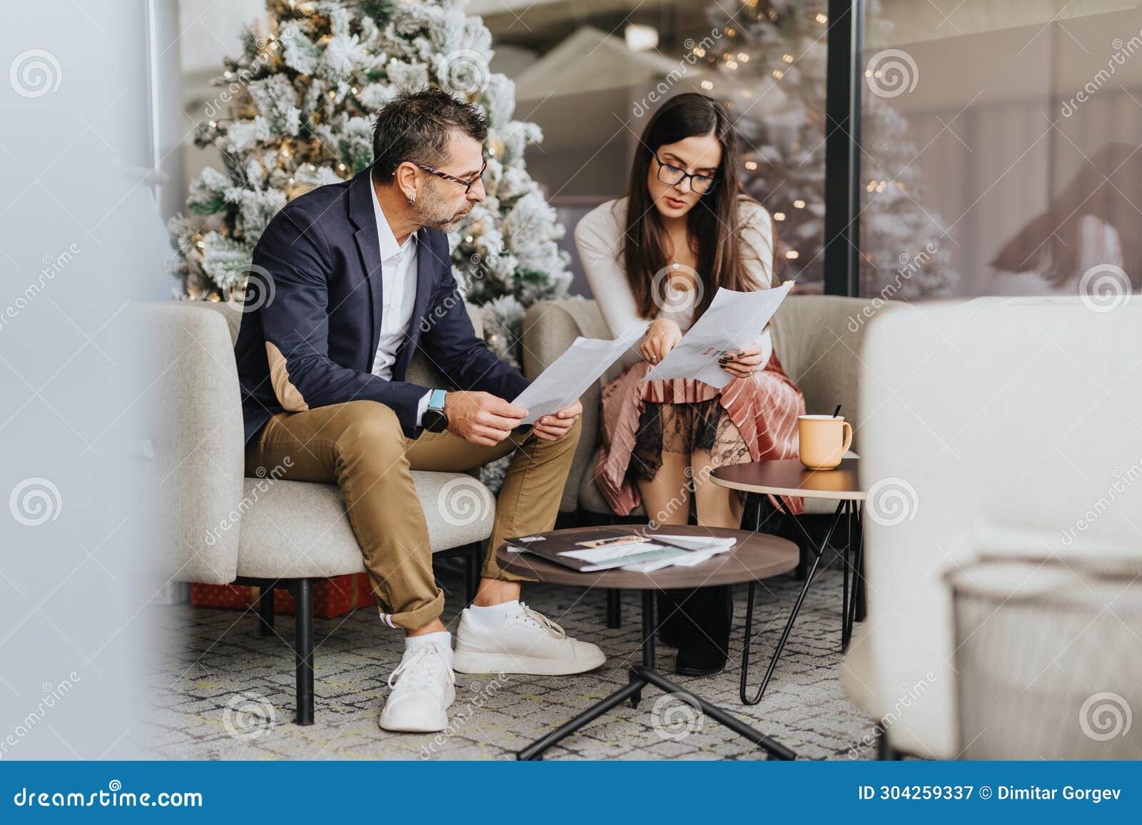 Creative Business Partners Collaborating on Growth Strategies, Analyzing Statistics, and ...