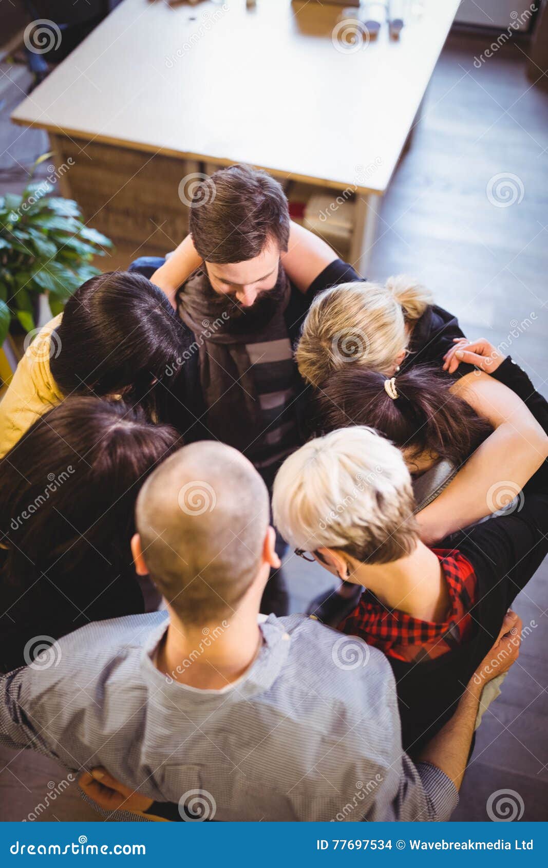 Creative Business People Forming Huddle in Office Stock Photo - Image ...