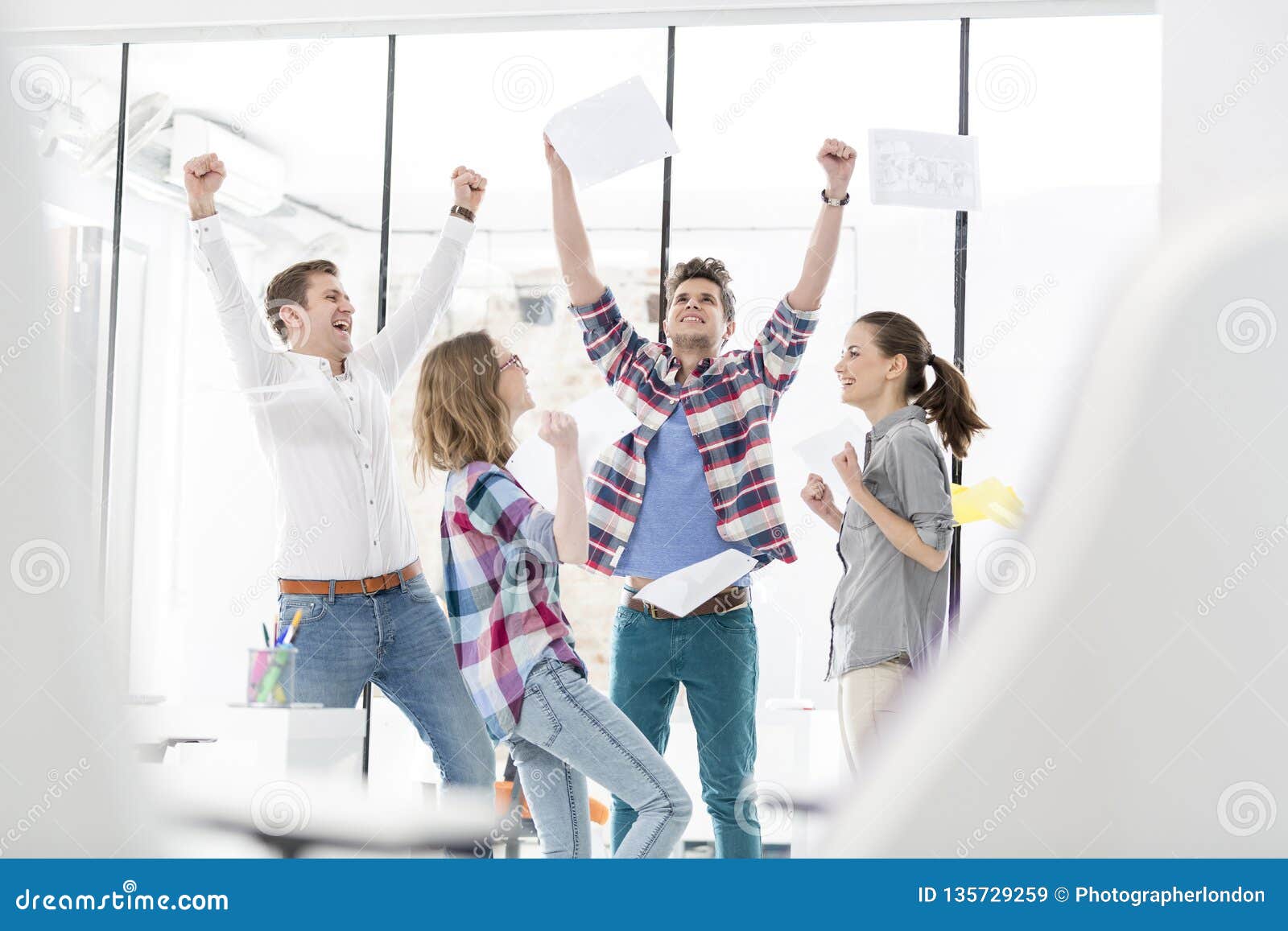Successful Business Colleagues Cheering in Office Stock Image - Image ...