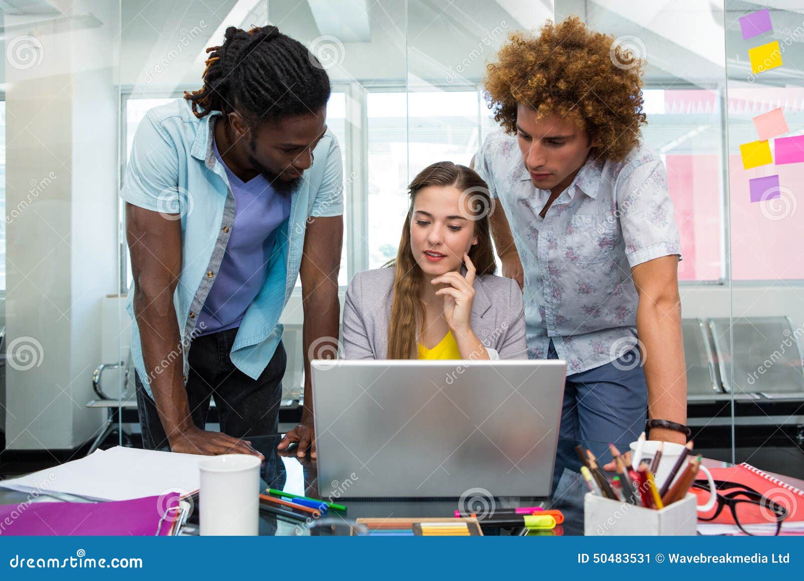 Creative Business People Using Laptop at Desk Stock Image - Image of ...