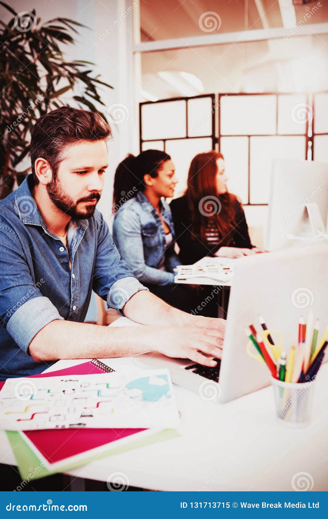 Creative Business People Using Technologies at Desk Stock Image - Image ...