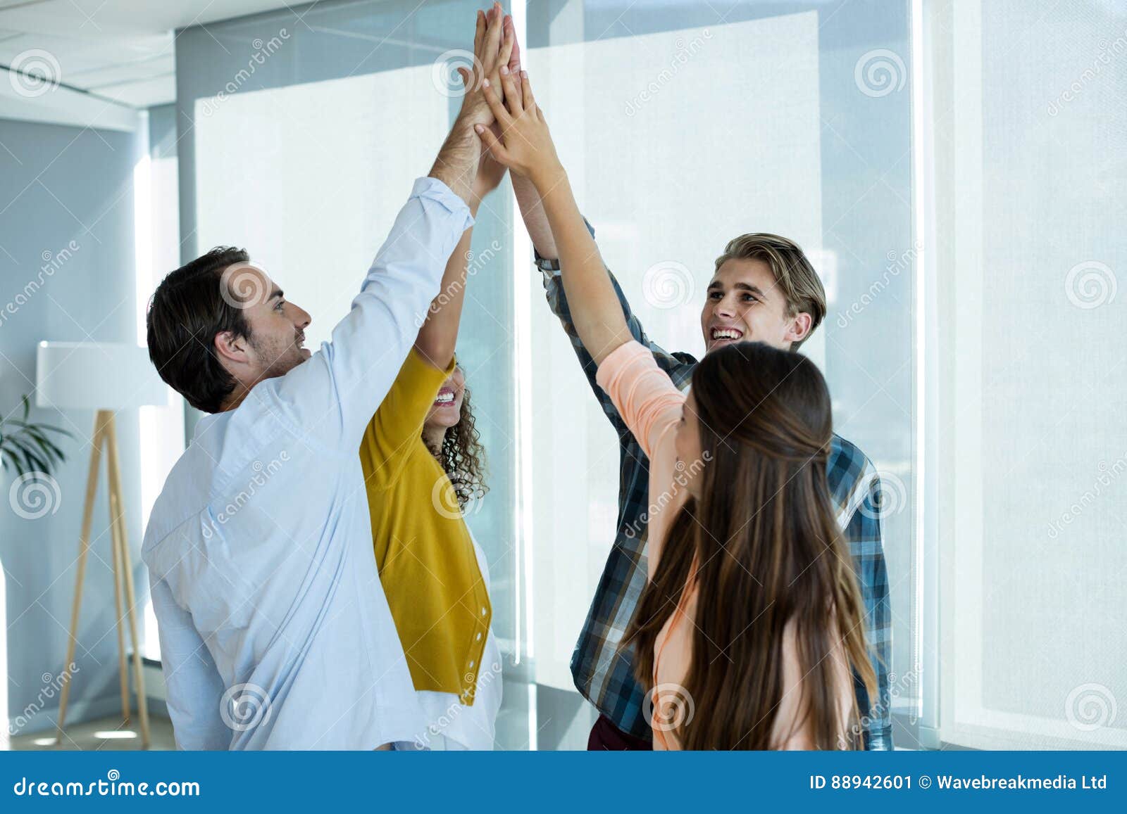 Creative Business Team Giving a High Five To Each Other Stock Image ...