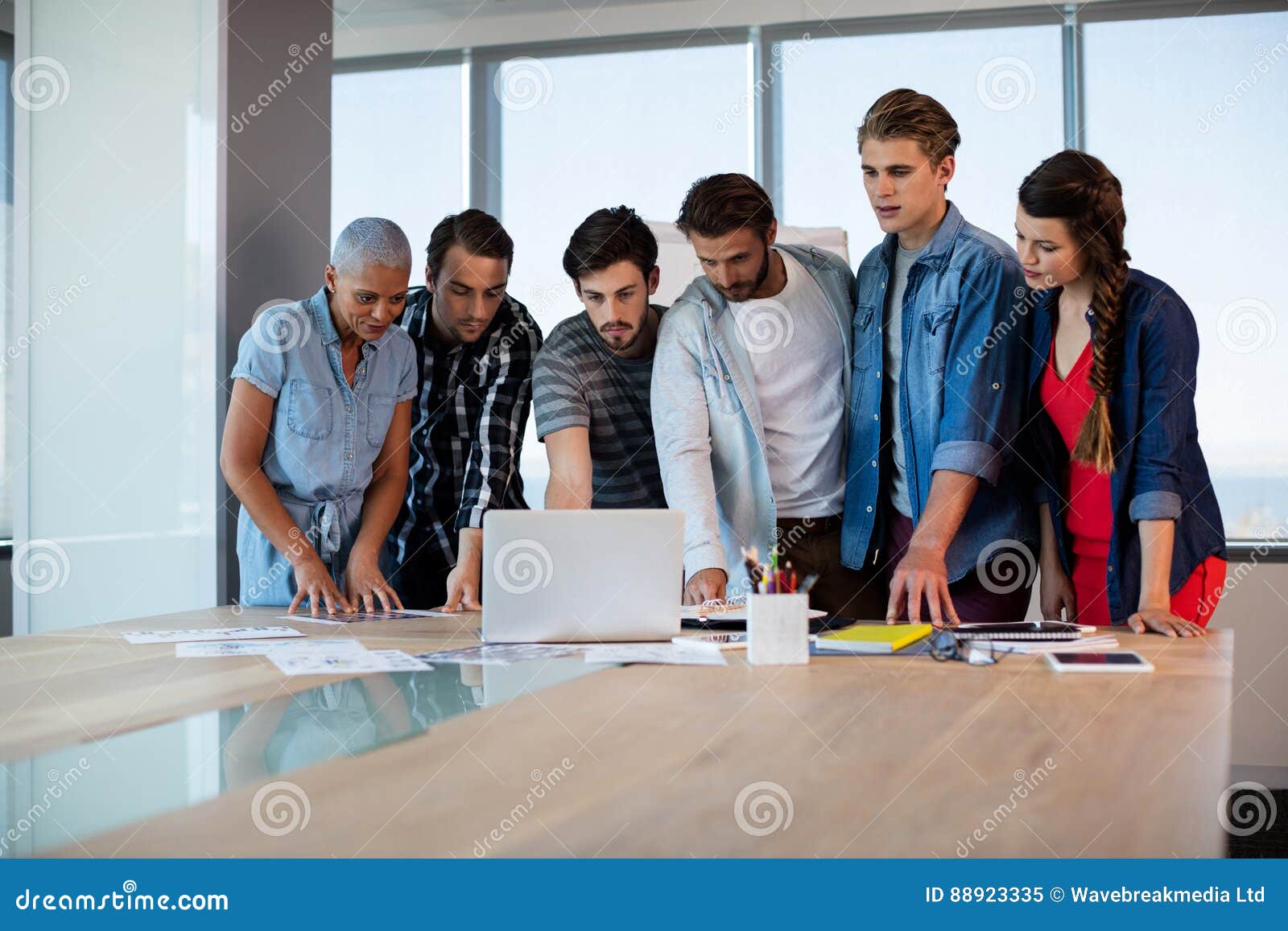 Creative Business Team Looking at Presentation in Laptop Stock Image ...