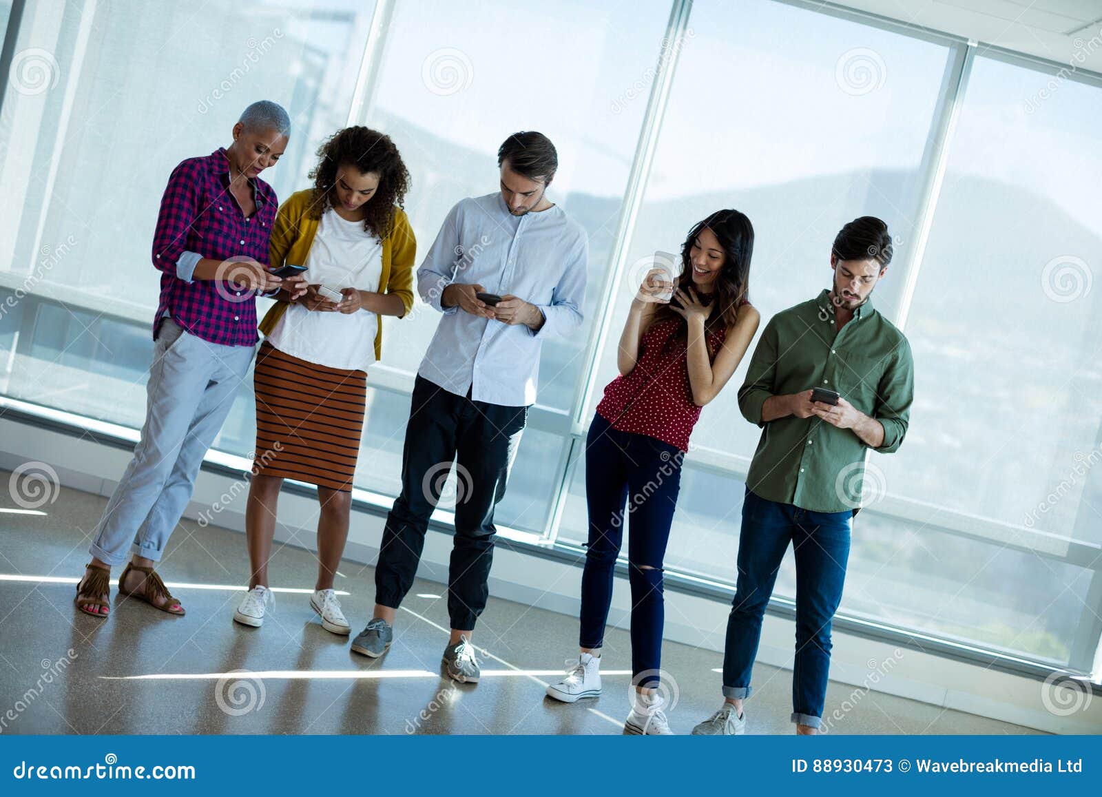 Creative Business Team Using Mobile Phone in Office Stock Image - Image ...