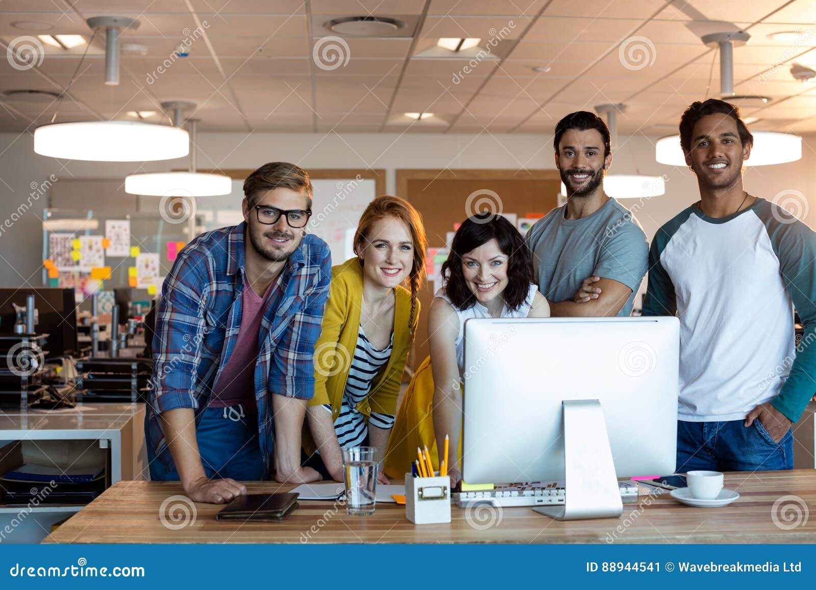 Creative Business Team Working Together on Desktop Pc in Office Stock ...