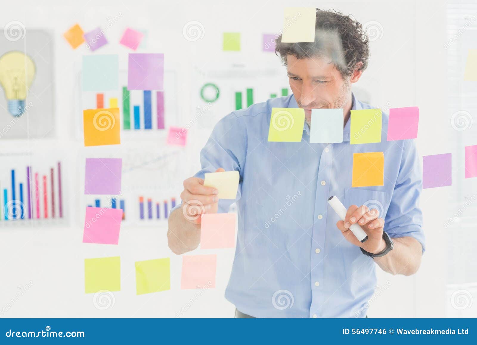Creative Businessman Looking at Post-it Stock Photo - Image of studio ...