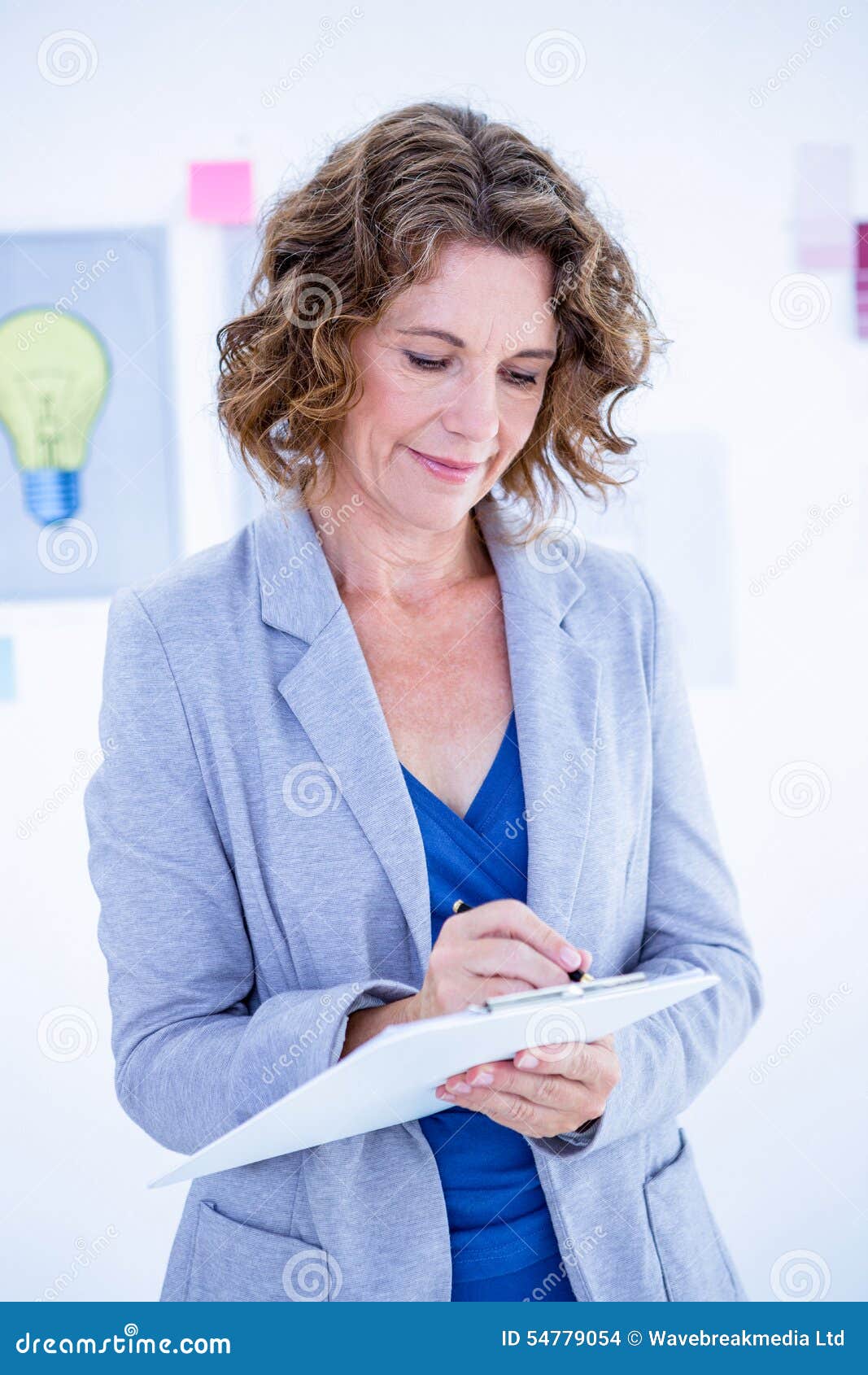 Creative Businesswoman Taking Note on Clipboard Stock Photo - Image of ...