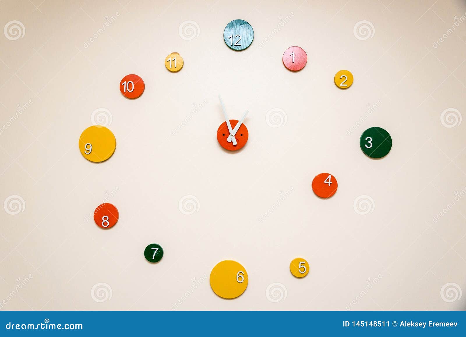 Creative Clock in the Form of Multi-colored Circles on the Wall Stock ...