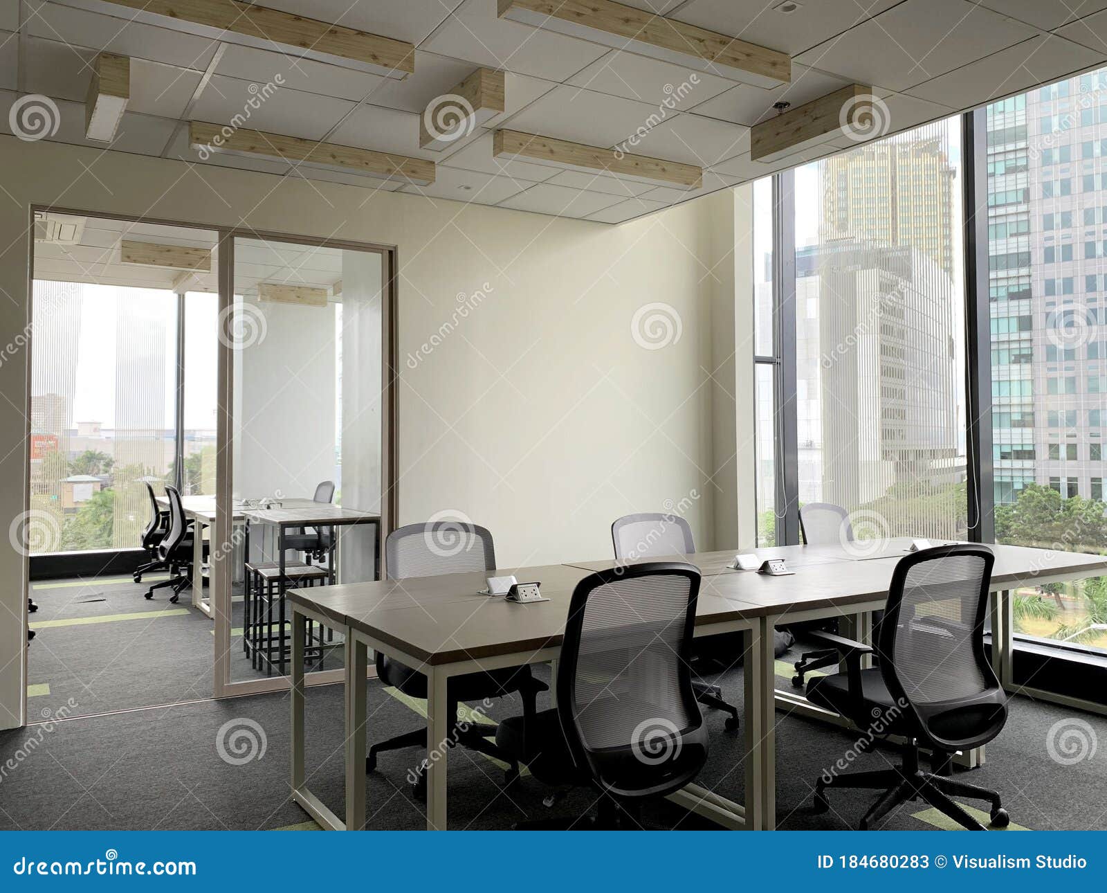 Cream Office With Brown Sofa, Work Desk, Poster And Large Wooden ...