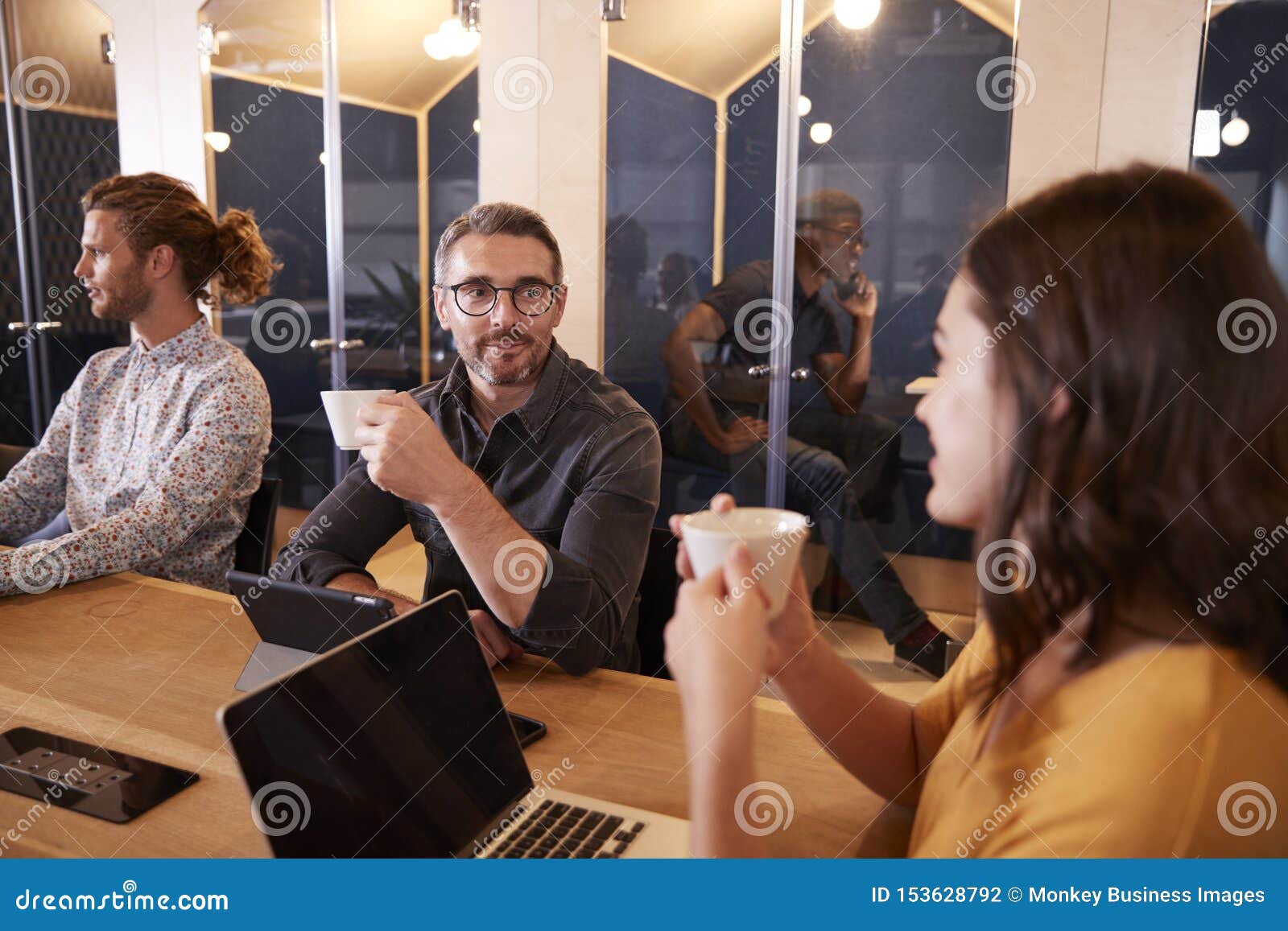 Creative Colleagues Drinking Coffee and Talking in Their Office Canteen ...