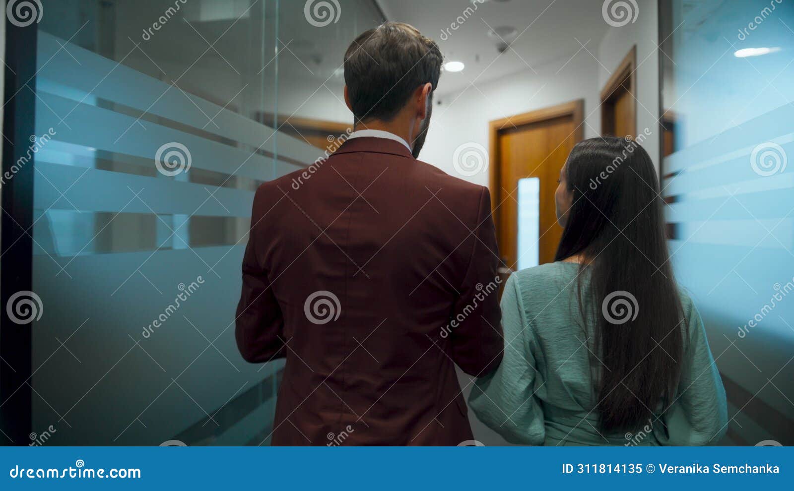 Creative Colleagues Going with Device at Meeting Room Back View. People ...