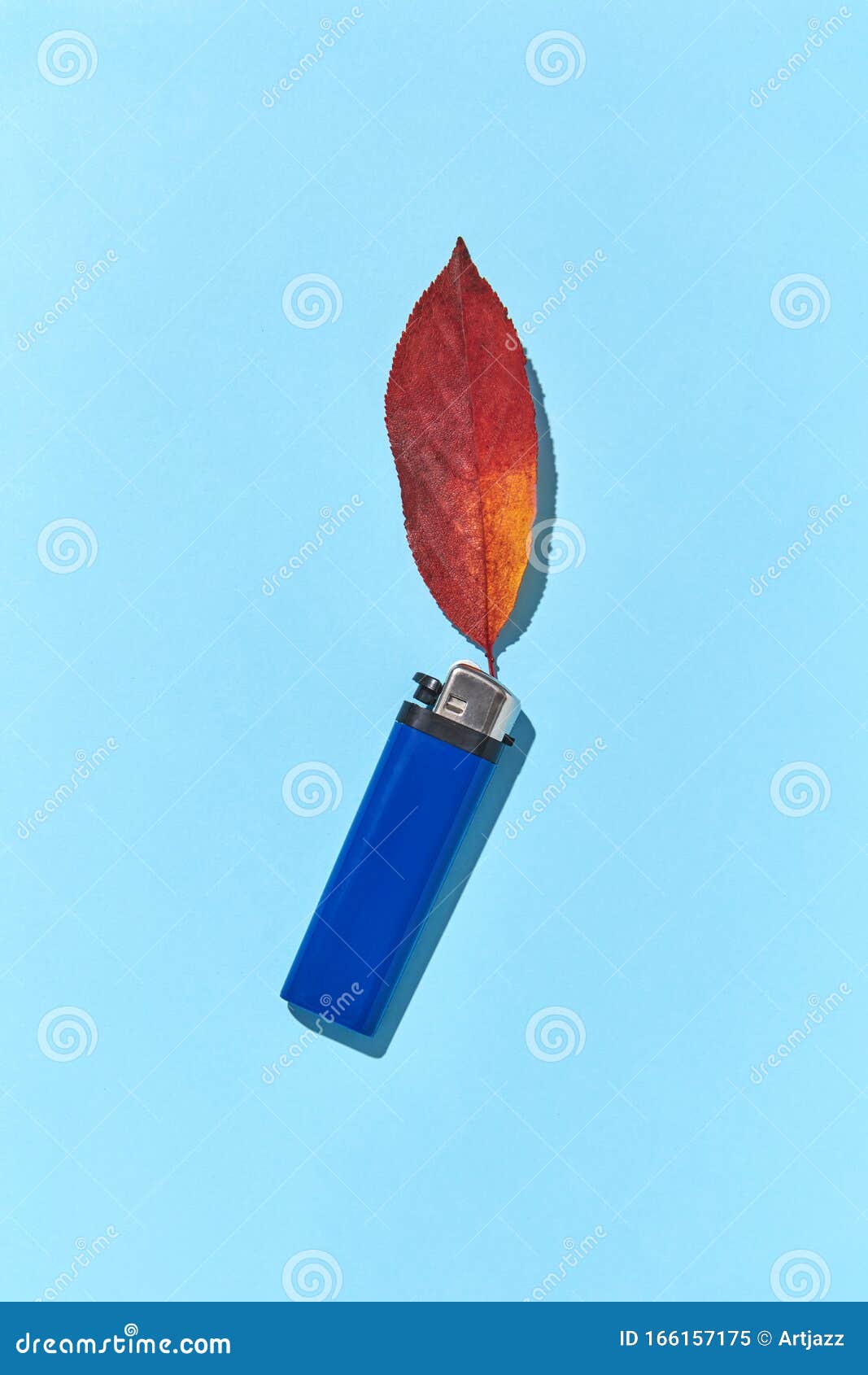 Creative Composition Blue Lighter with Fire from Fall Red Leaf and Hard ...