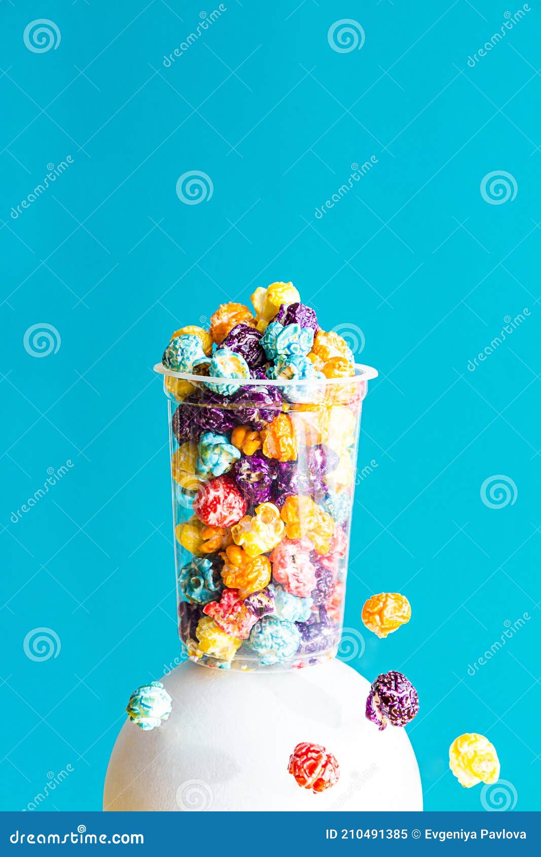 Creative Composition with Colored Popcorn in a Transparent Glass on a ...