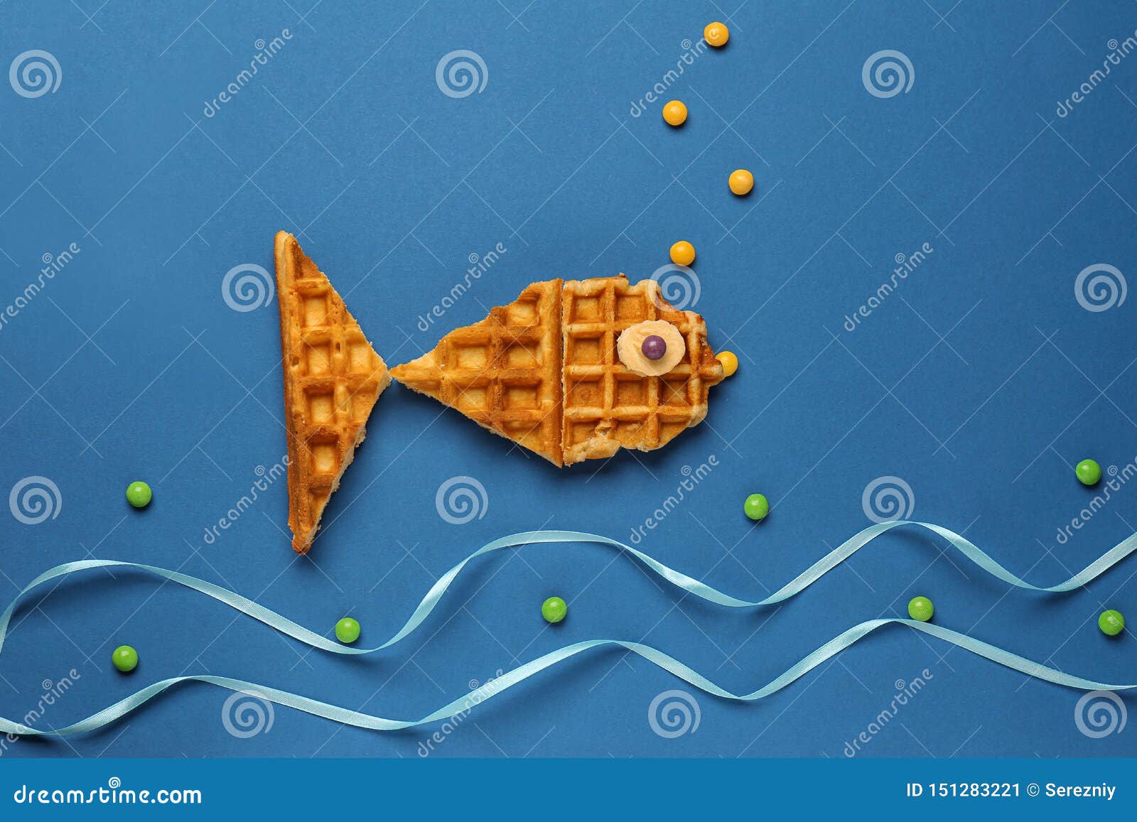 Creative Composition with Fish Made of Waffles on Color Background ...