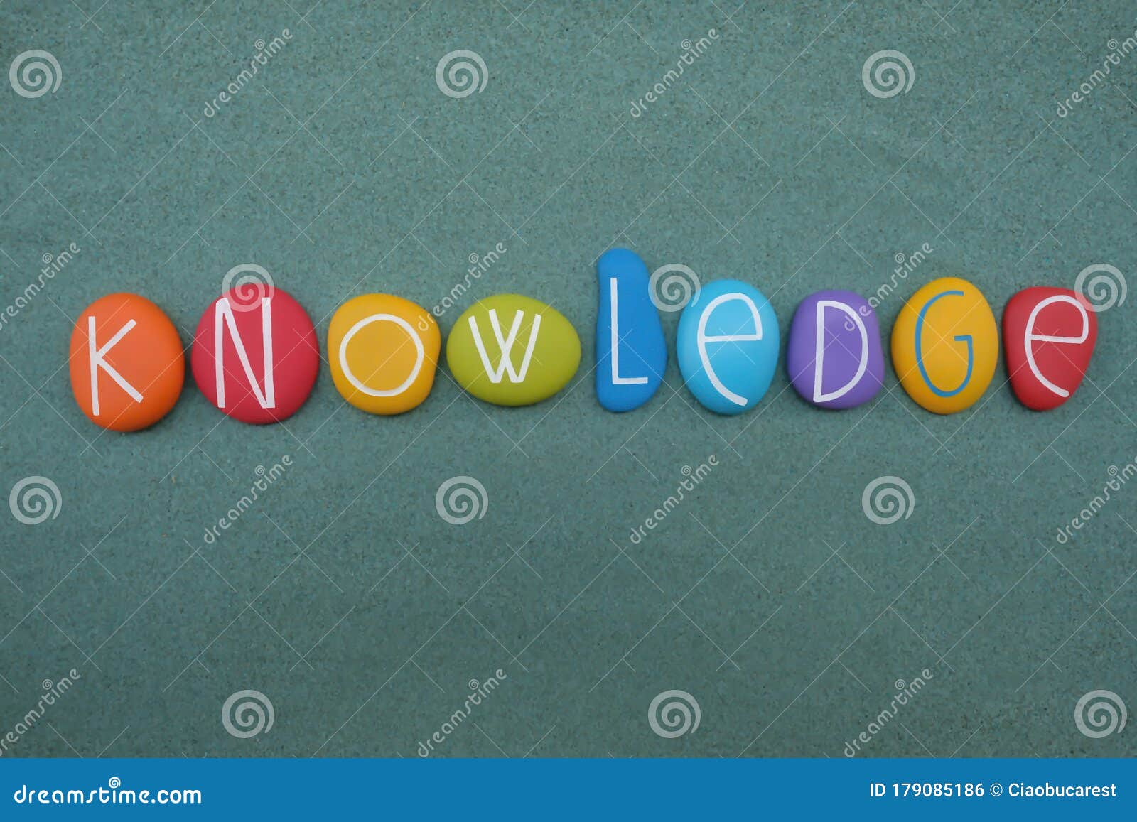 Knowledge Word Composed with Multi Colored Stone Letters Over Green ...