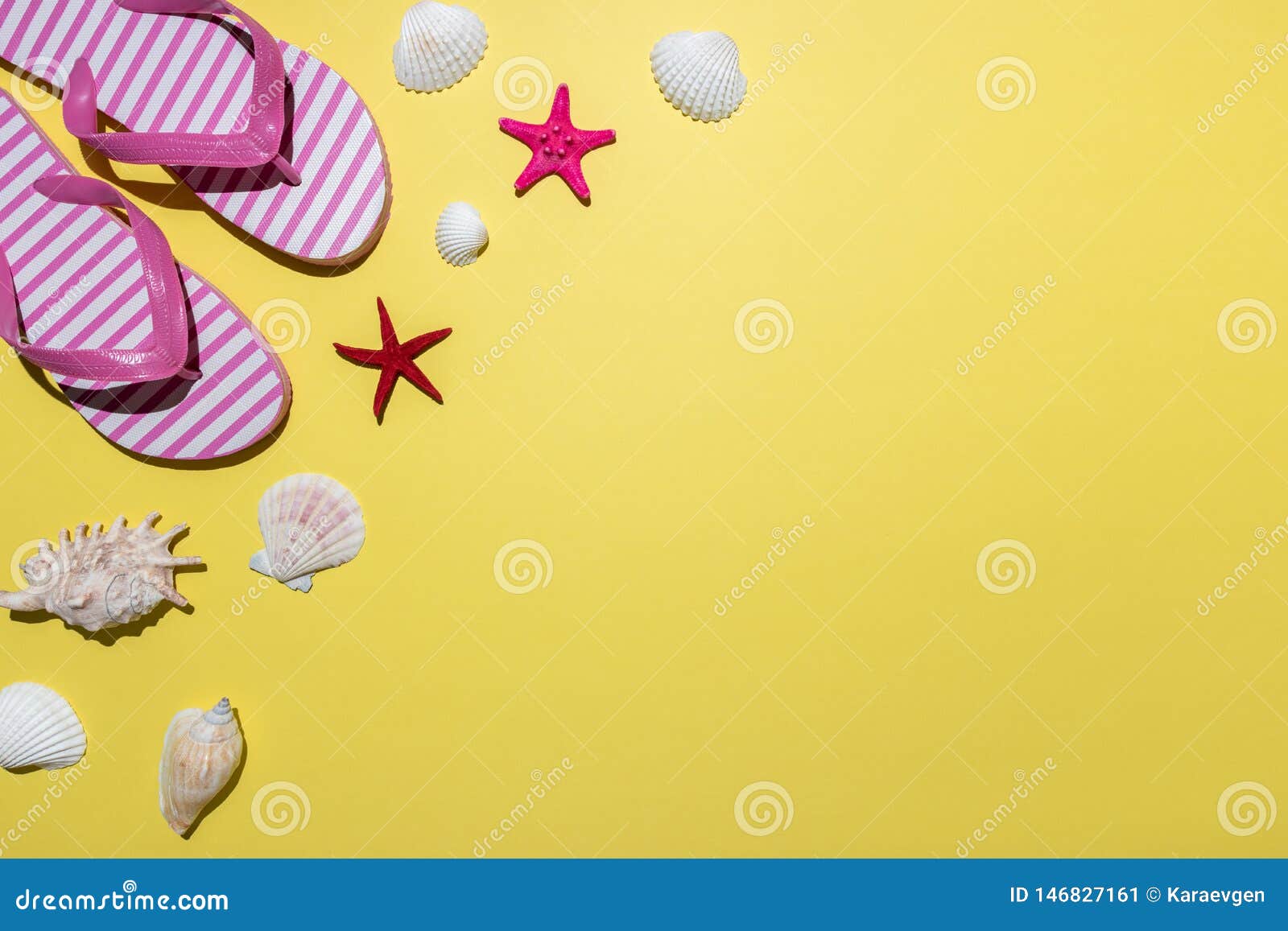 Creative Composition with Seashells and Beach Slippers on Bright Yellow ...