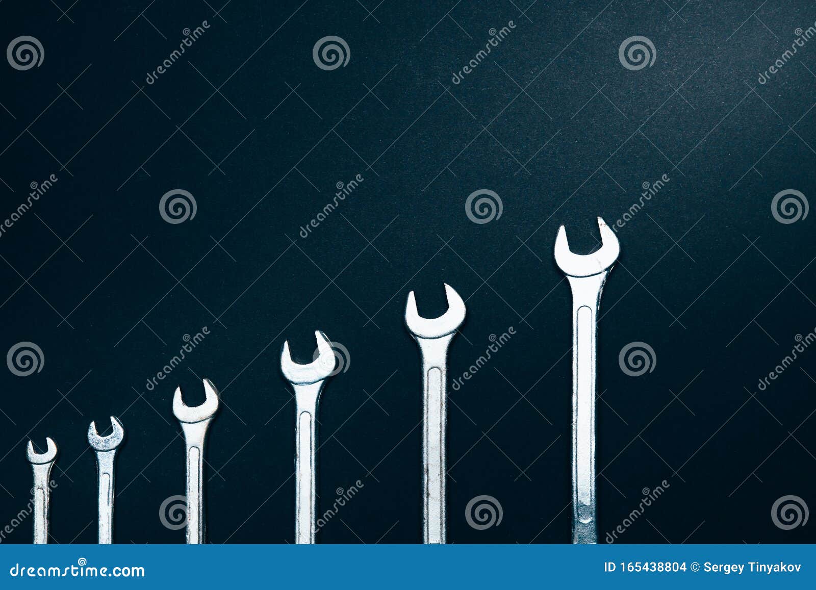 Creative Concept of Professional Growth. Different Sizes of Wrenches on ...