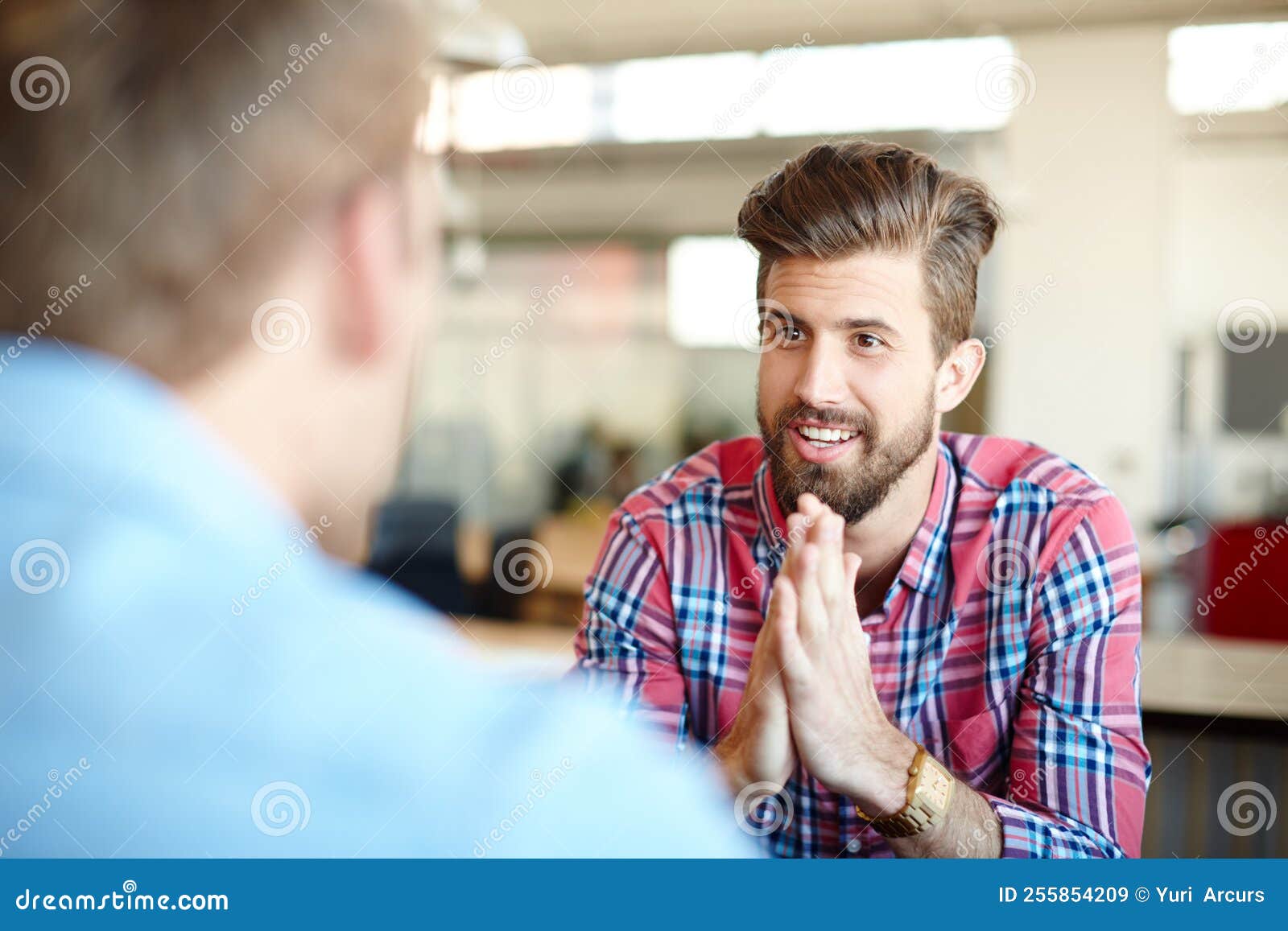 Creative Conversations. a Young Male Designer Having a Conversation ...