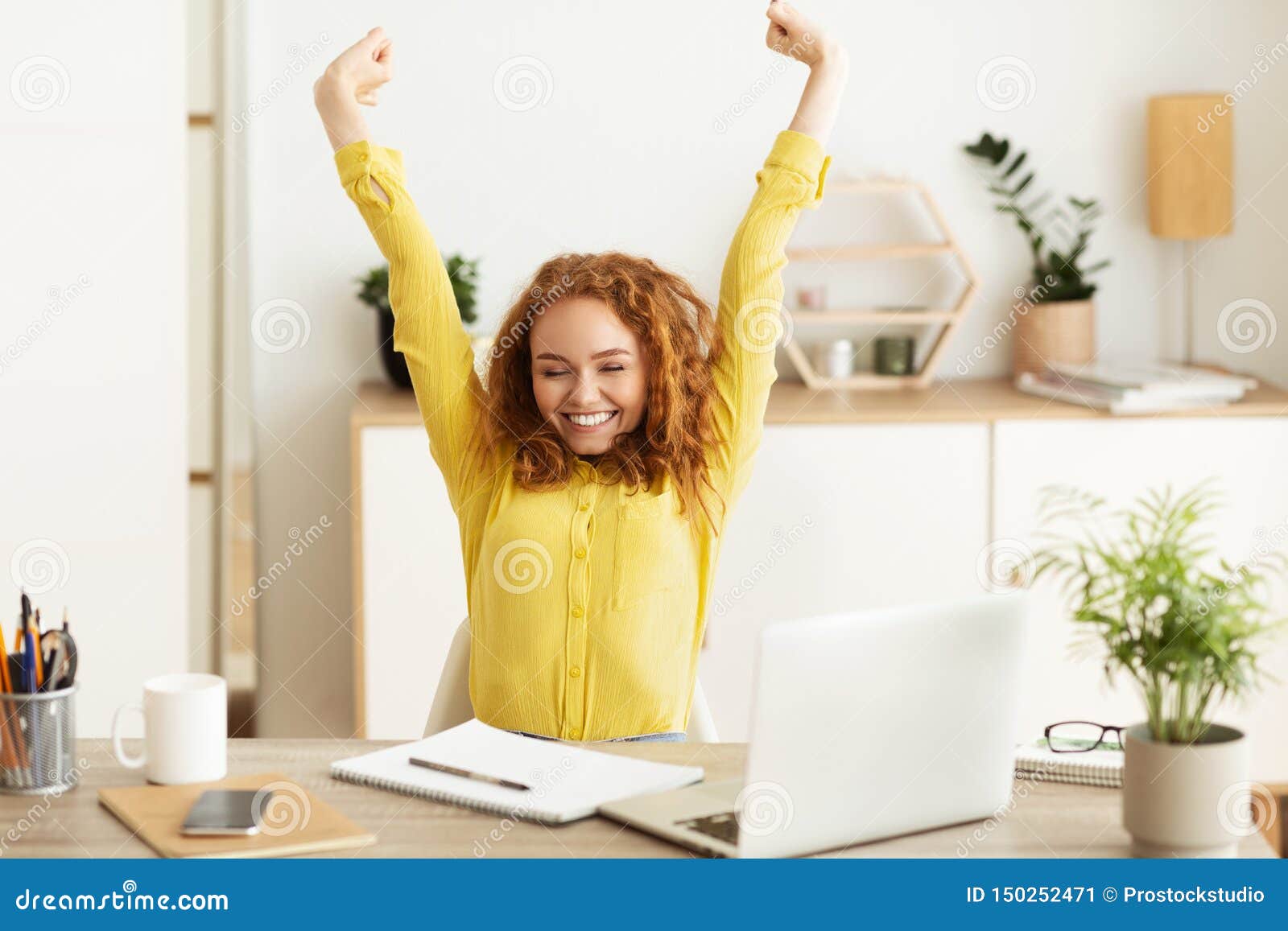 Creative Designer Stretching in Front of Laptop Computer Stock Image ...