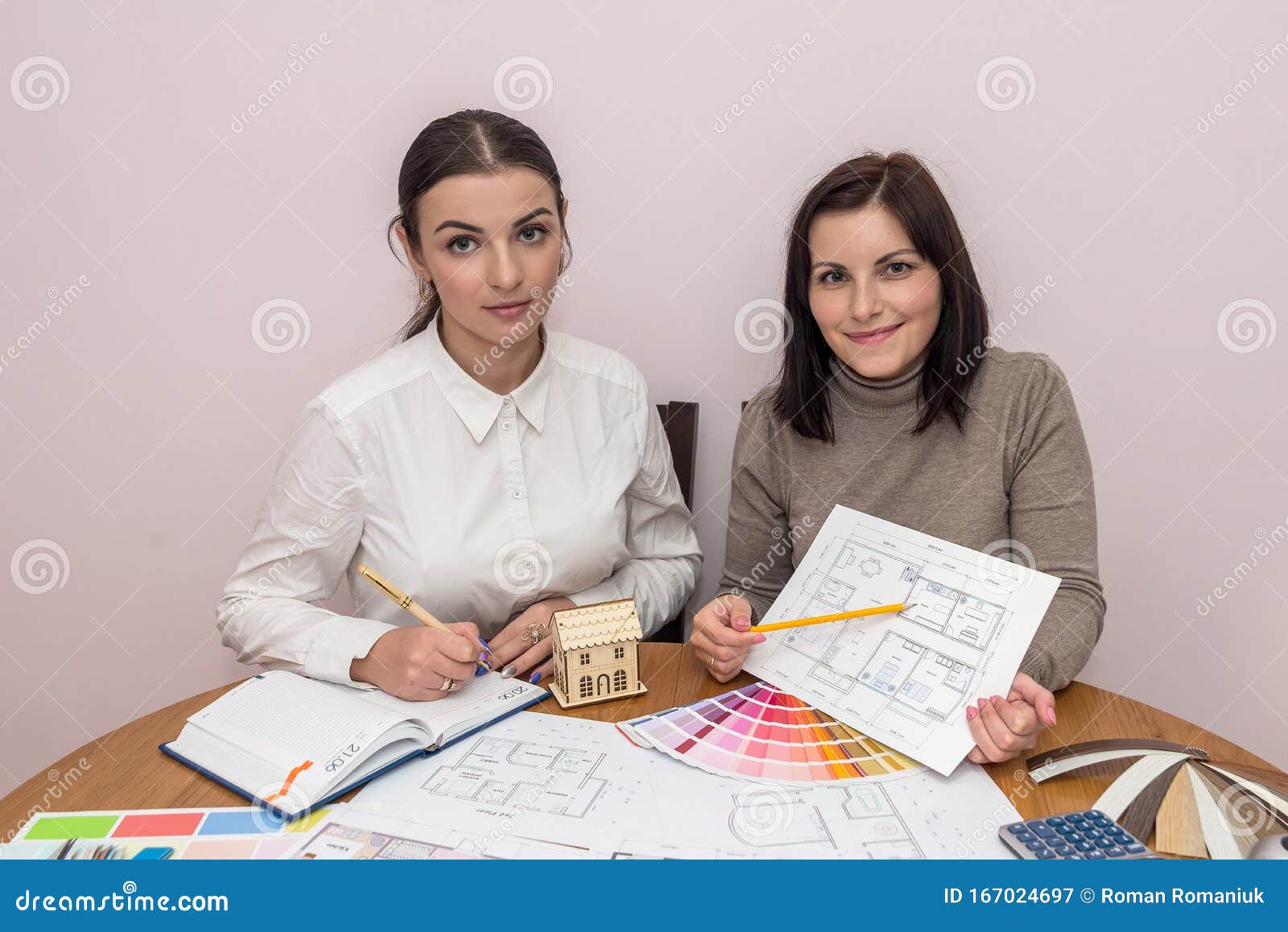 Creative Designers Showing House Plan and Posing for Camera Stock Image ...