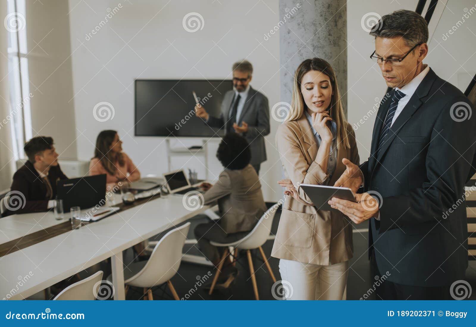 Creative Executives Using Digital Tablet in Office Stock Image - Image ...