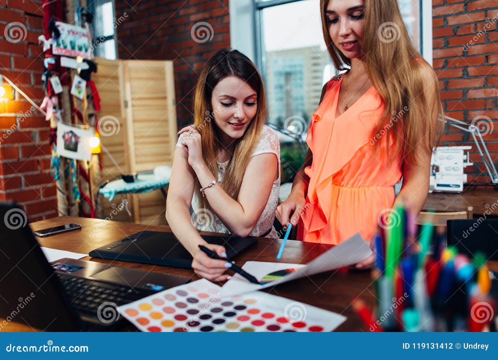 Creative Female Interior Decorator Working with a Customer in Her ...