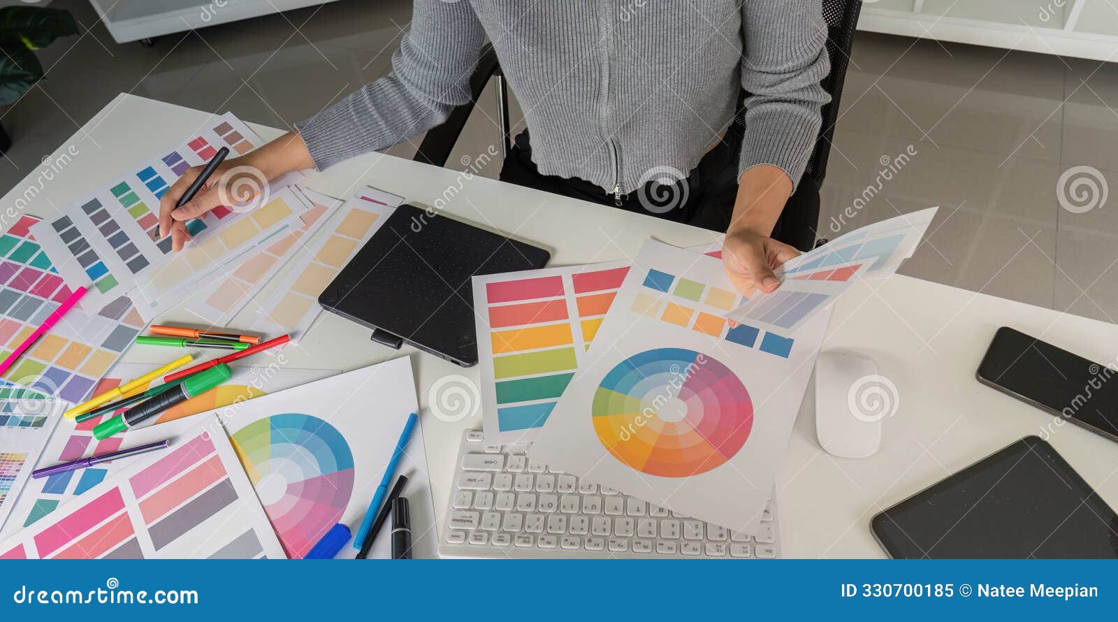 Creative Graphic Designer Working on Color Palettes and Design Concepts ...