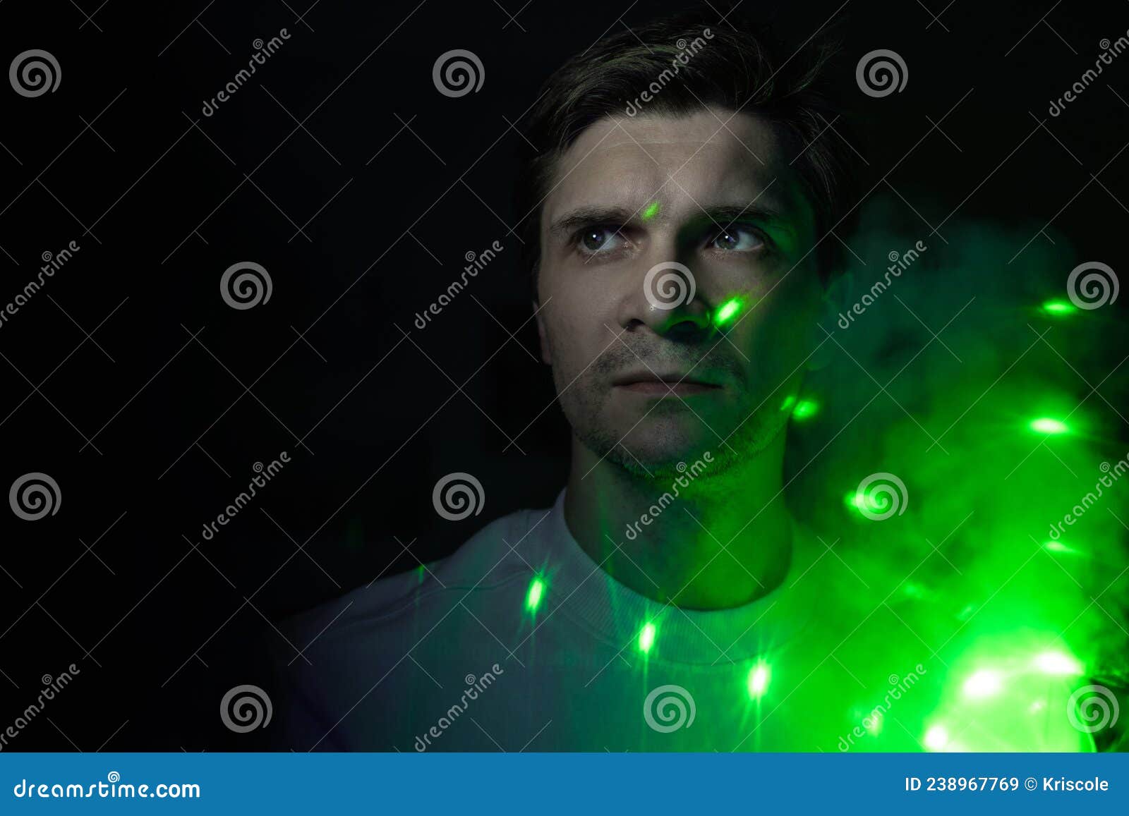 Creative Idea, Concept. Young Man and a Projection of Colored Patterns ...