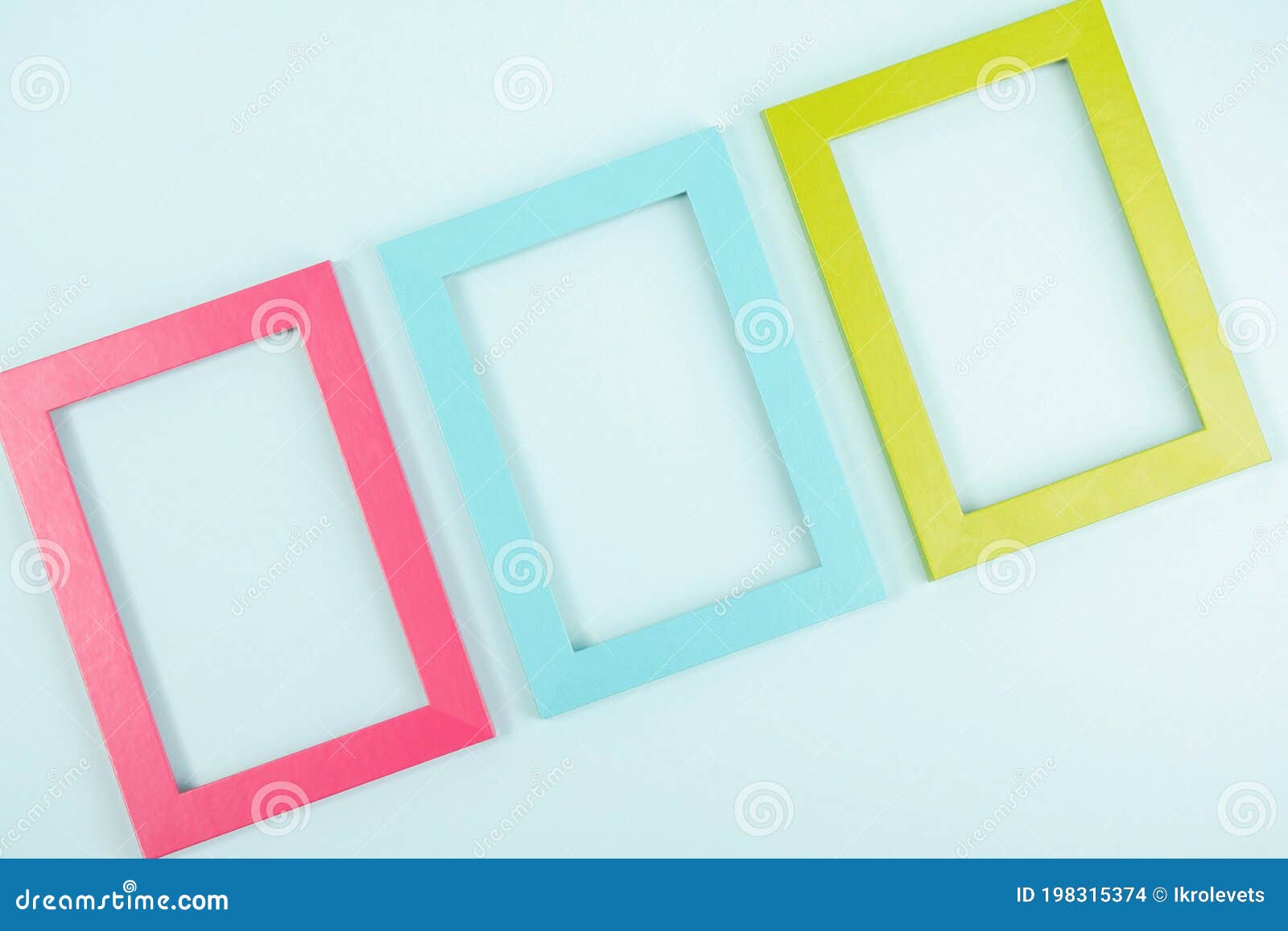 Creative Layout Made of Three Bright Colored Frames on Blue Background ...