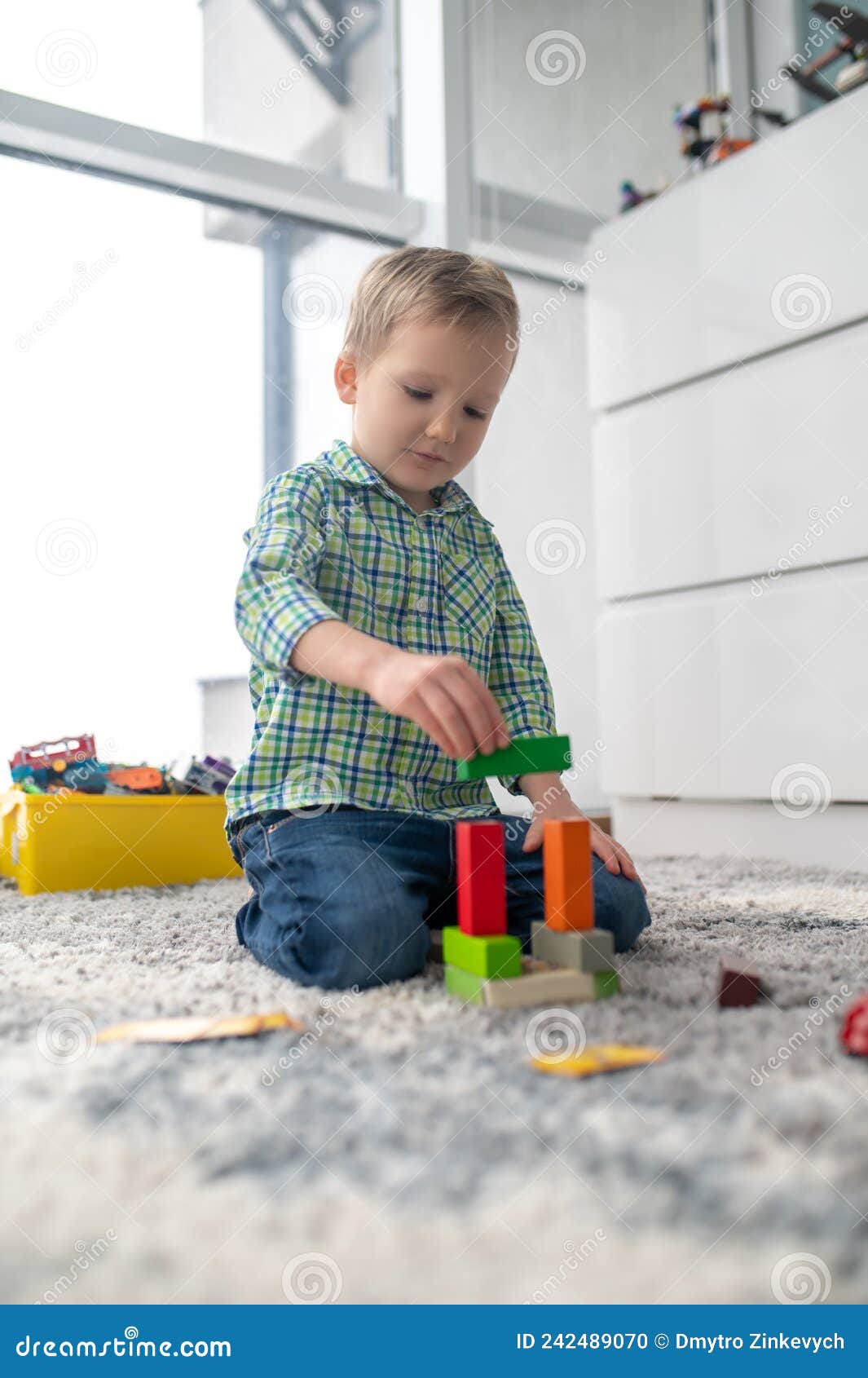 Creative Little Boy Constructing a Building Structure from Toy Blocks ...