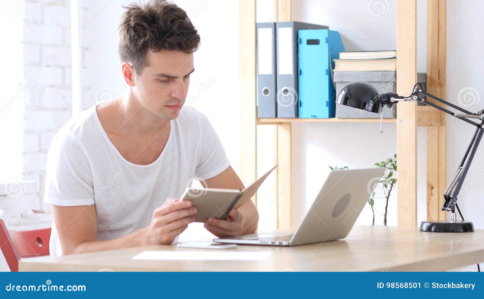 Creative Man Reading at Work in His Office Stock Image - Image of ...