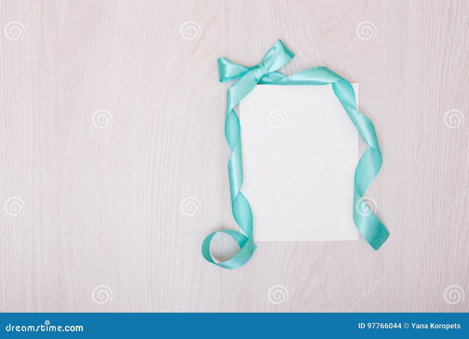 Creative Mock Up with Ablank Piece of Paper. Blue Ribbon and Bow Stock ...