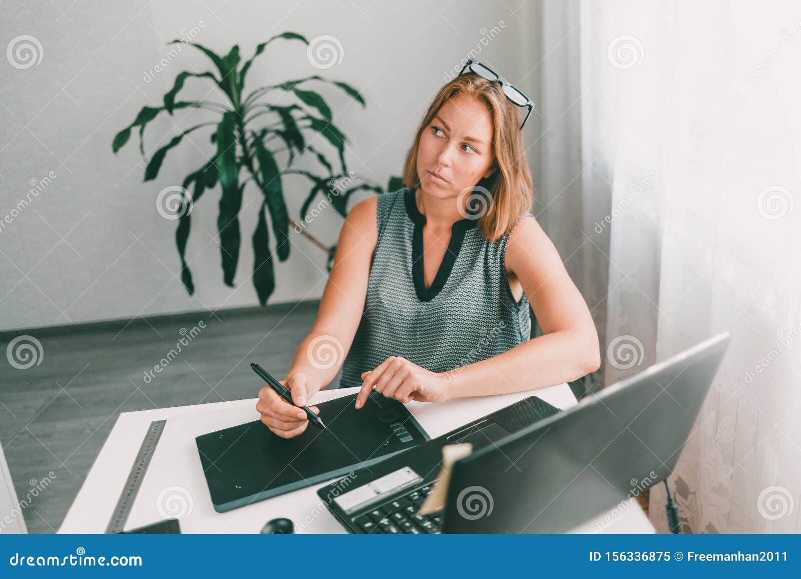 Creative and Office Work. the Young Woman in Charge of the Retouching ...