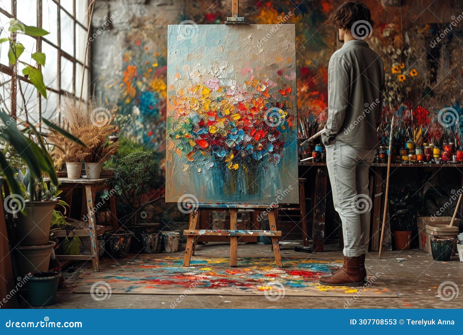 Creative Painter is Standing in His Workshop and Painting Beautiful ...