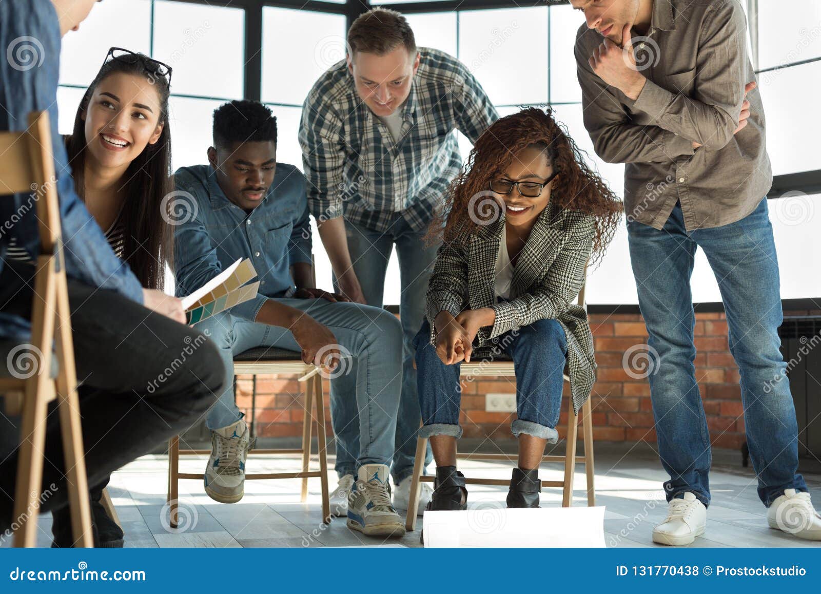 Creative People Looking at Project Plan on Floor Stock Photo - Image of ...