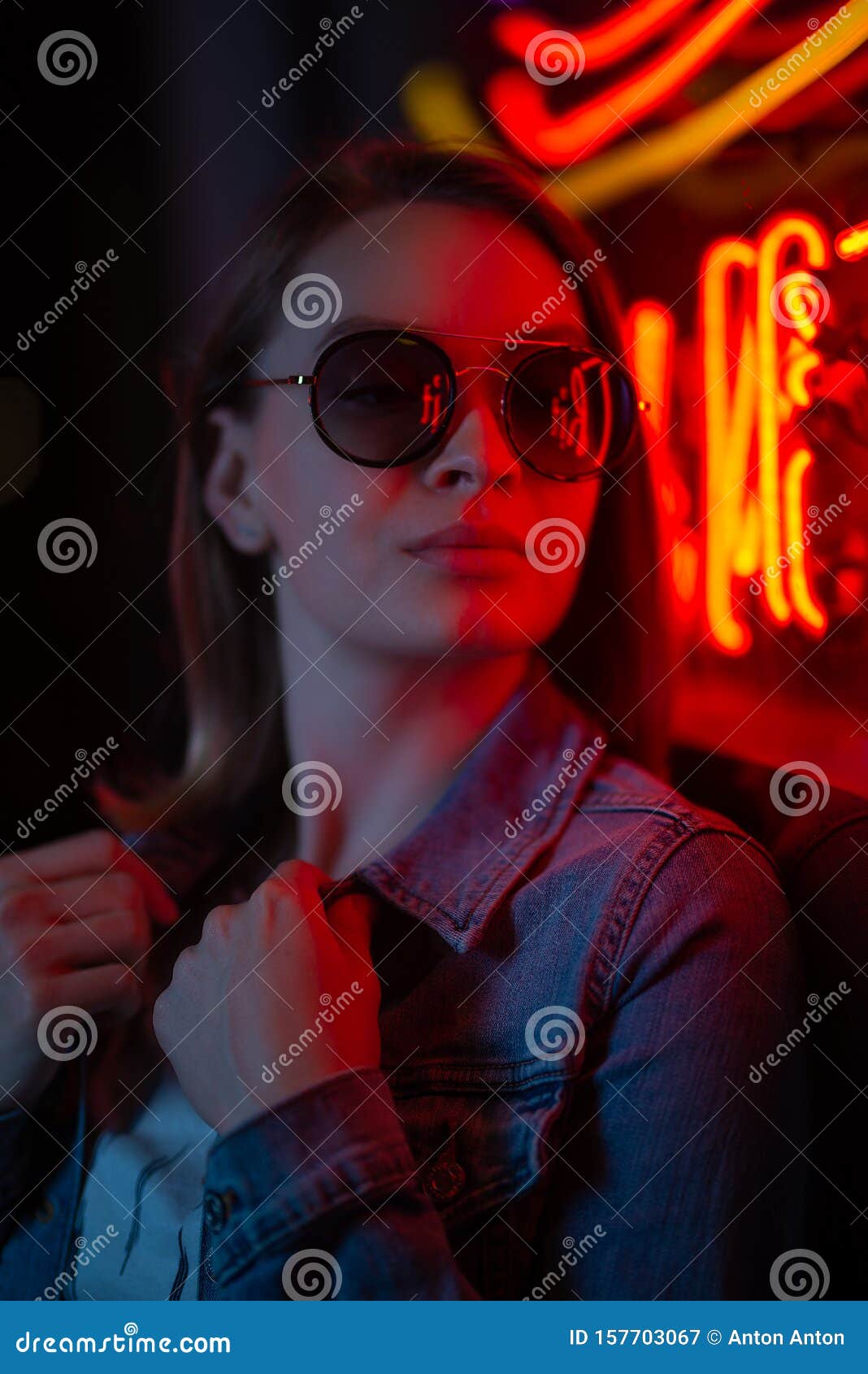 Creative Portrait Of A Girl In Neon Lighting With Glasses Stock Image