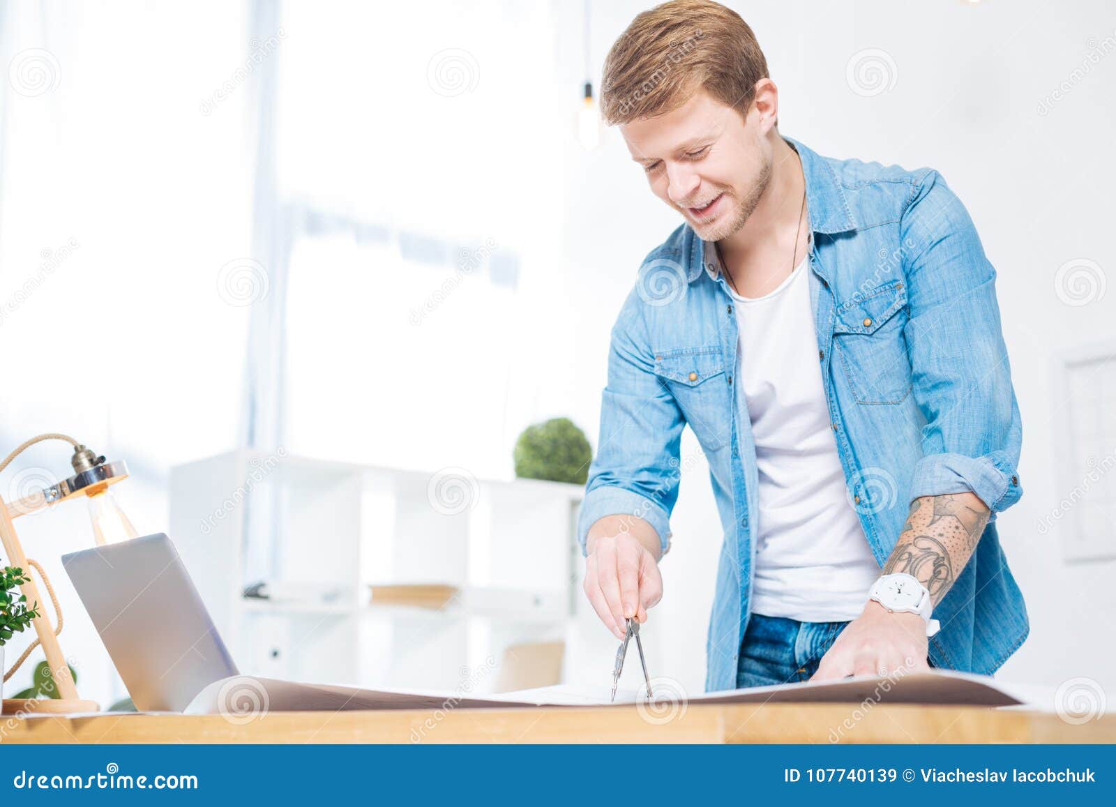 Calm Clever Engineer Holding a Pair of Compasses and Looking Confident ...