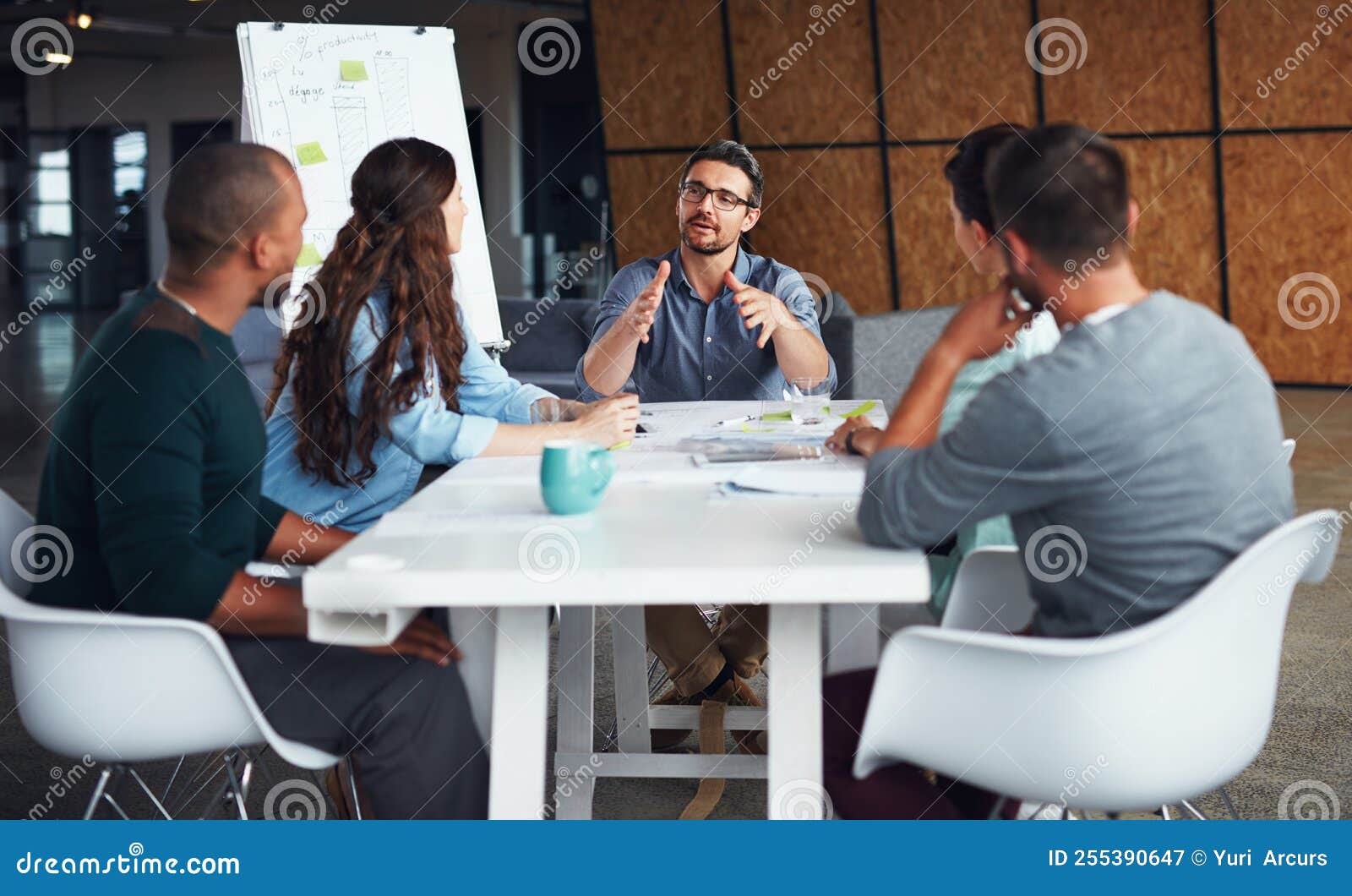 The Creative Process. a Mature Manager Talking To His Team while ...