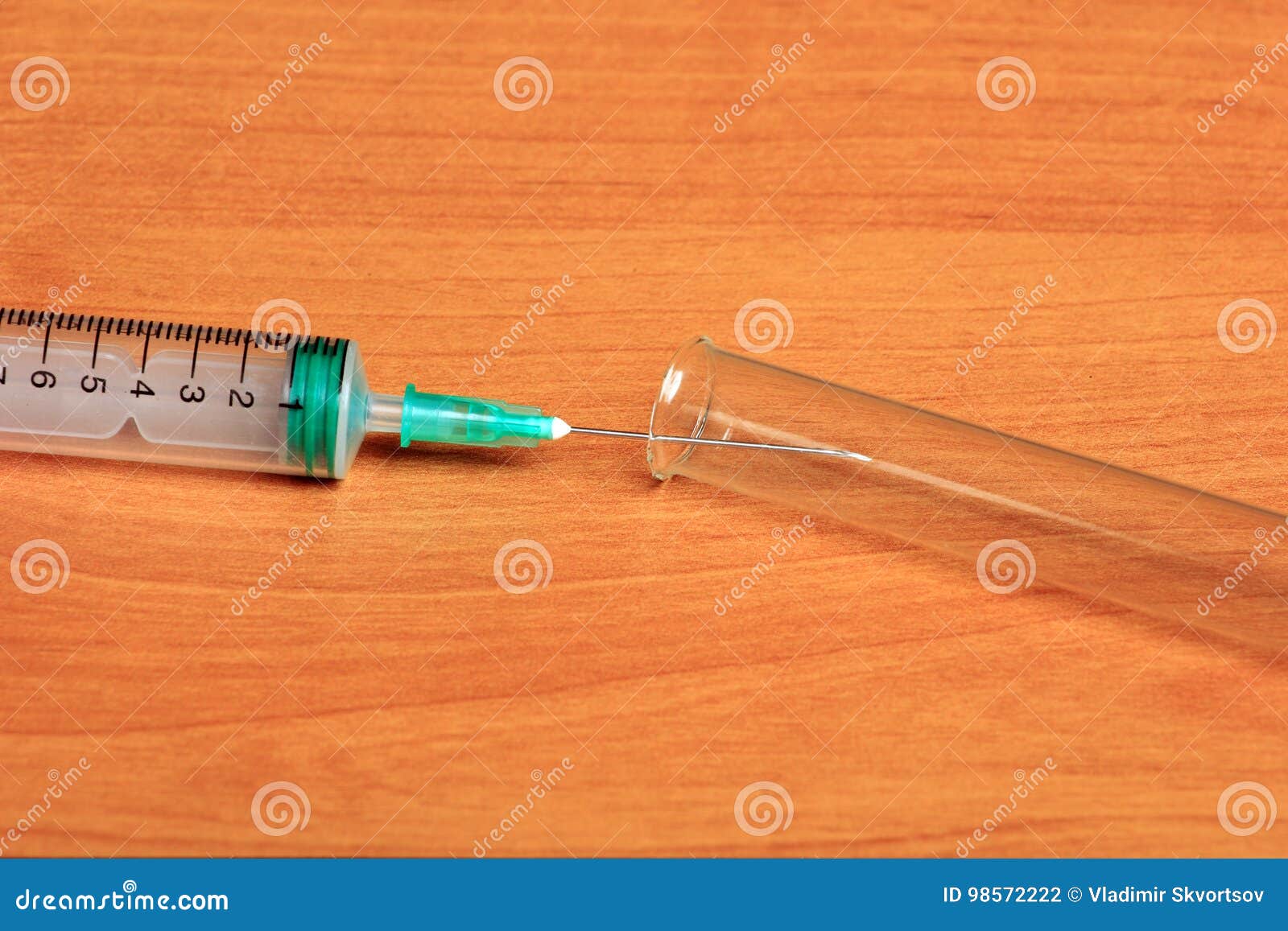 Creative Set of Medical Syringe on Wood Background Stock Photo - Image ...